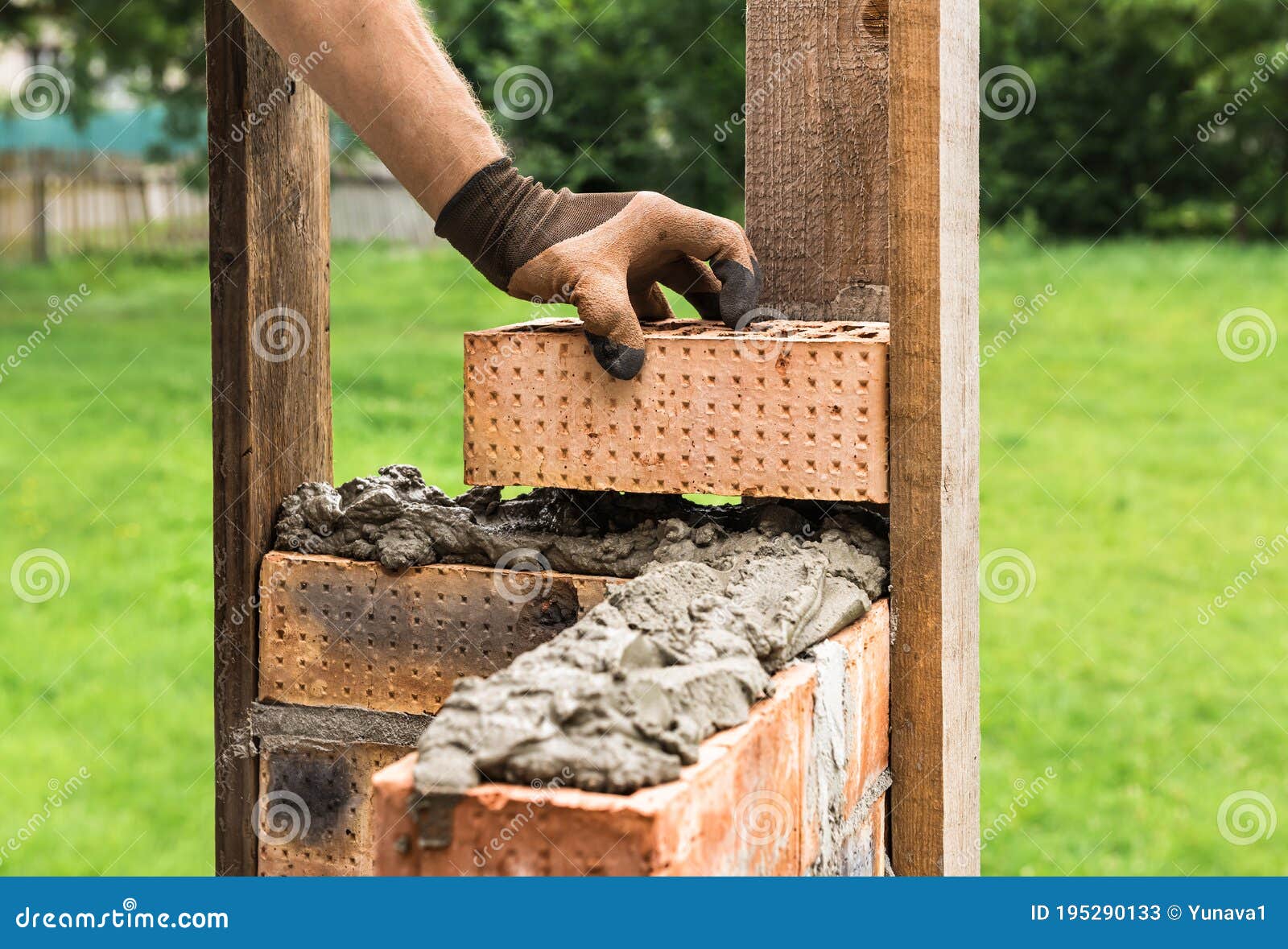 A Worker is Laying a Brick Wall Stock Image - Image of repair ...