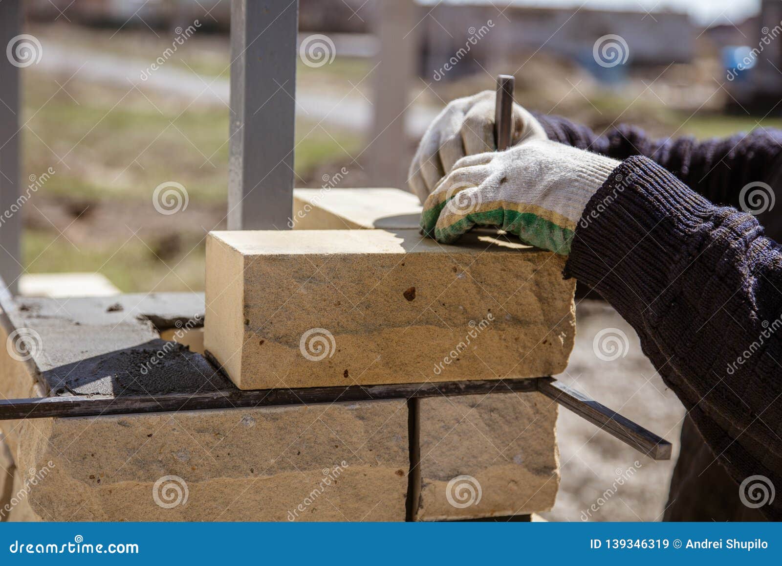 The Worker is Laying Bricks on the Fence Stock Image - Image of spatula ...