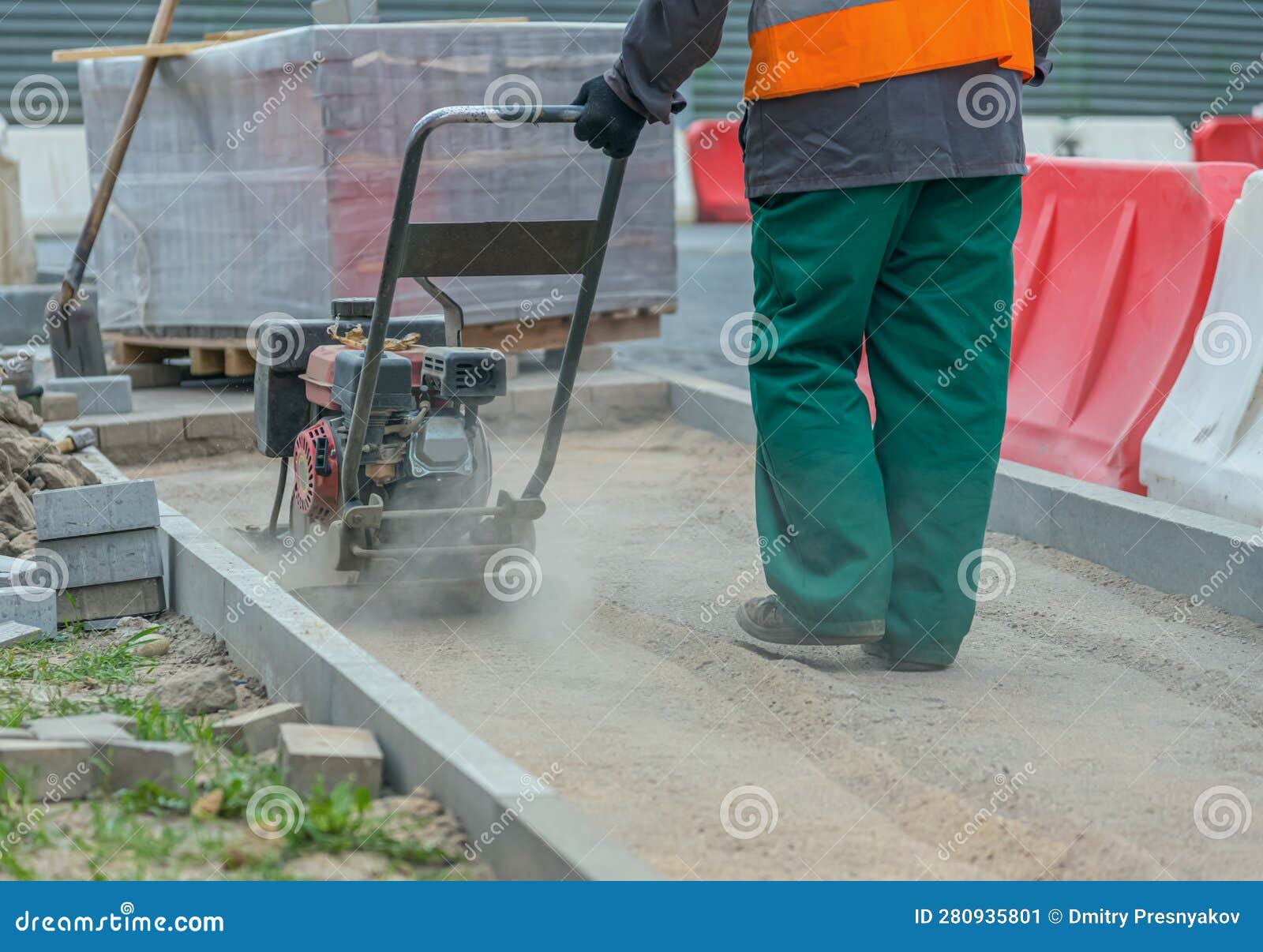 Worker Lays Asphalt. Site Construction Preparation. Sand Tamper Stock ...