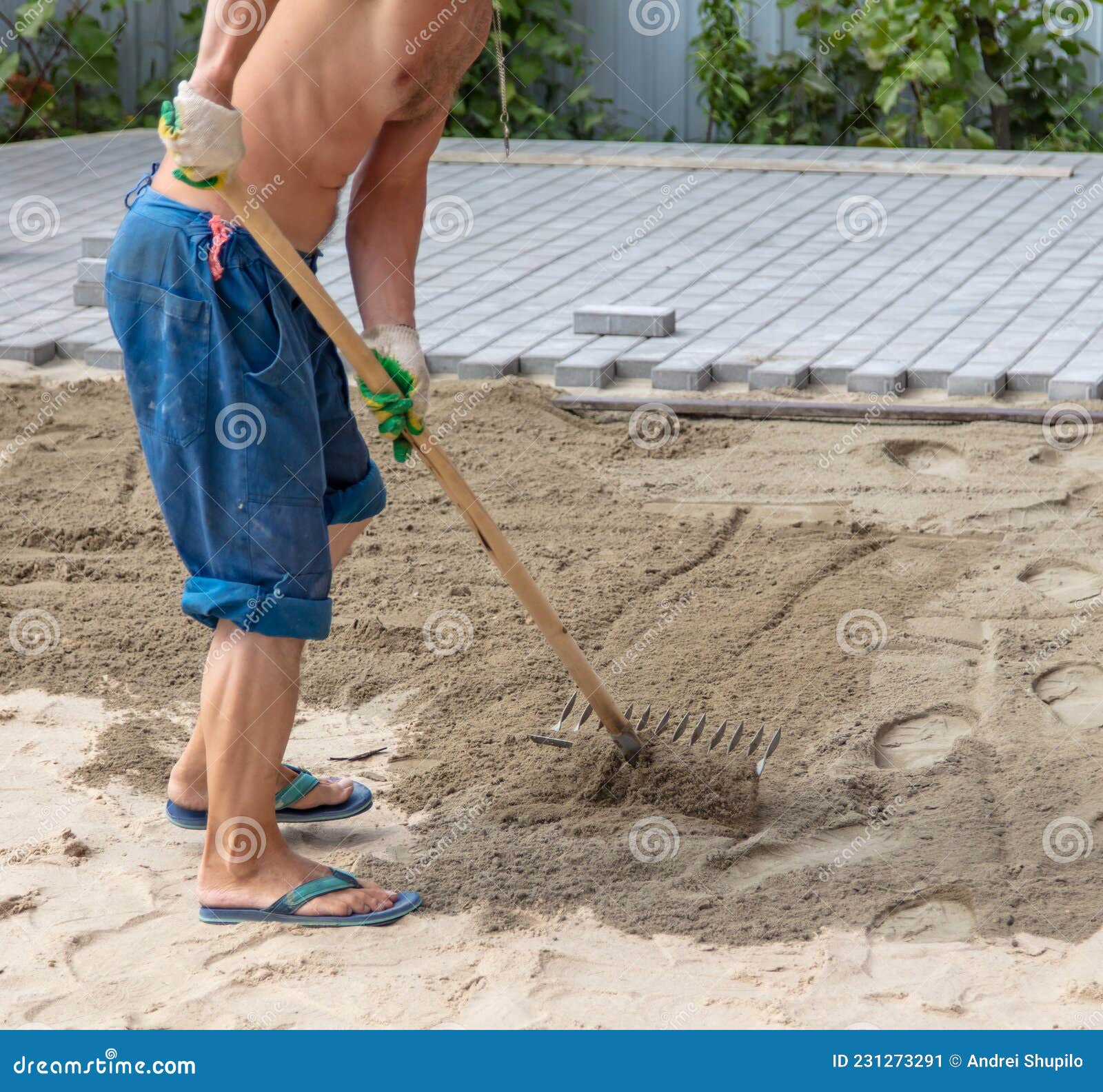 A Worker Lays Down Sand for Paving Slabs. Stock Image - Image of floor ...