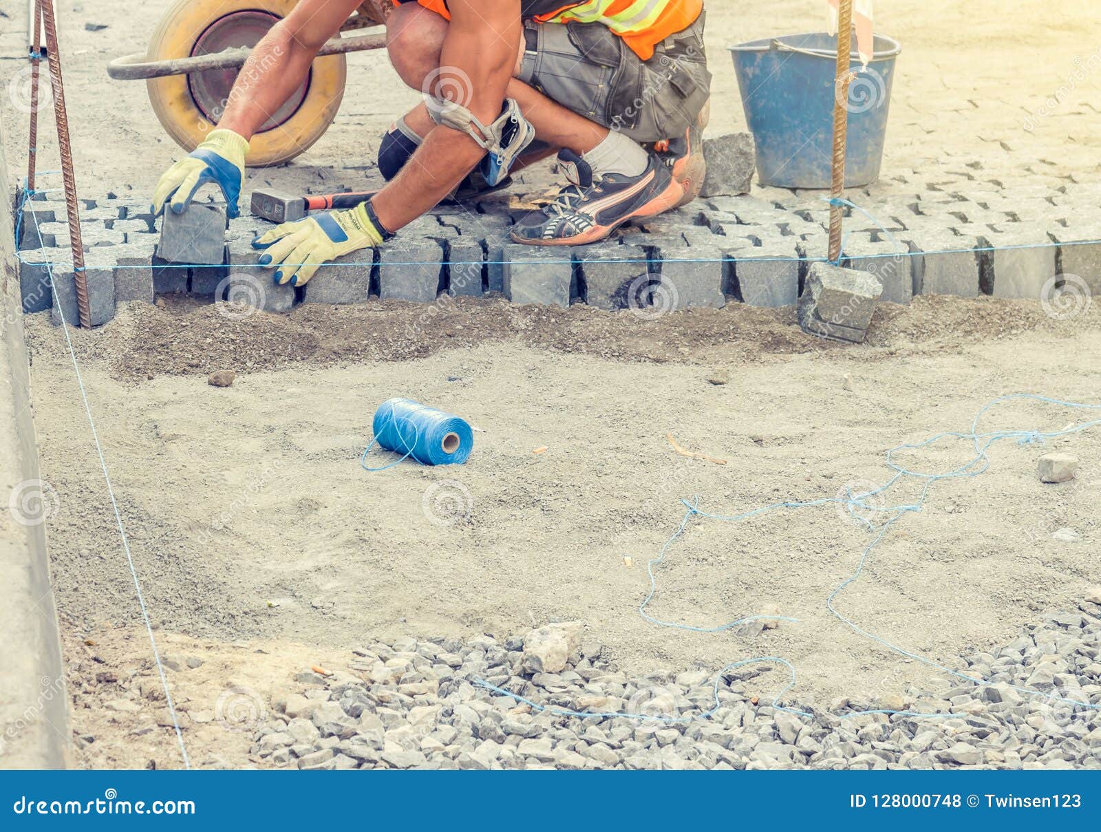 Worker Lays Granite Tiles on the Pavement Stock Photo - Image of ...