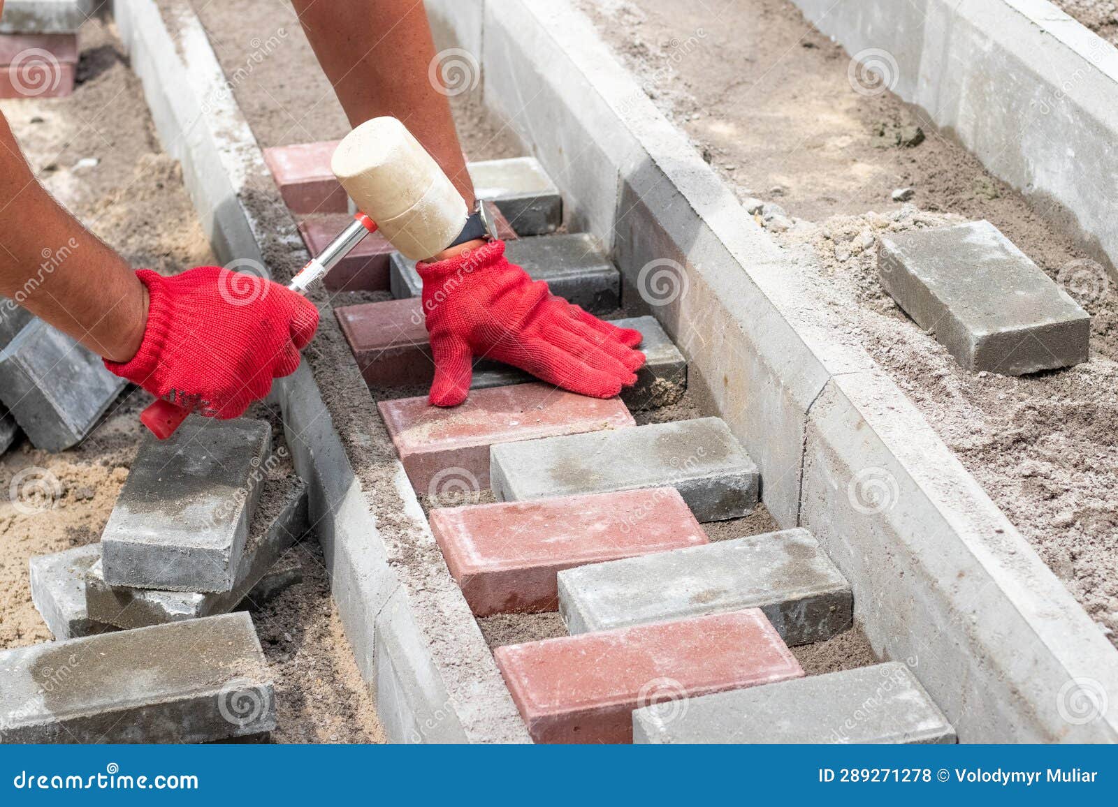 A Worker Lays Paving Slabs on a Staircase in a Park Stock Photo - Image ...
