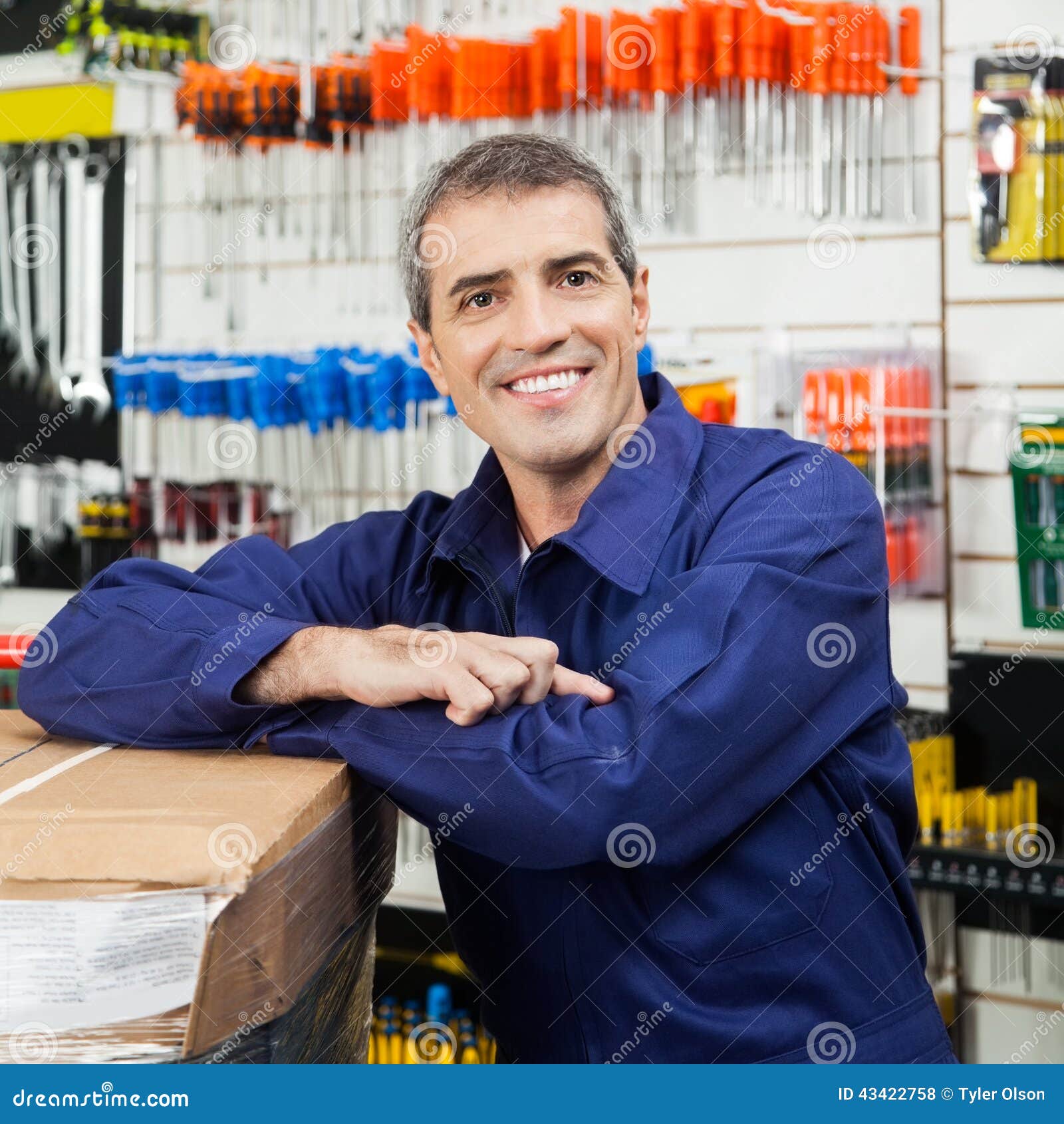 Worker Leaning on Tool Package in Hardware Shop Stock Photo - Image of ...