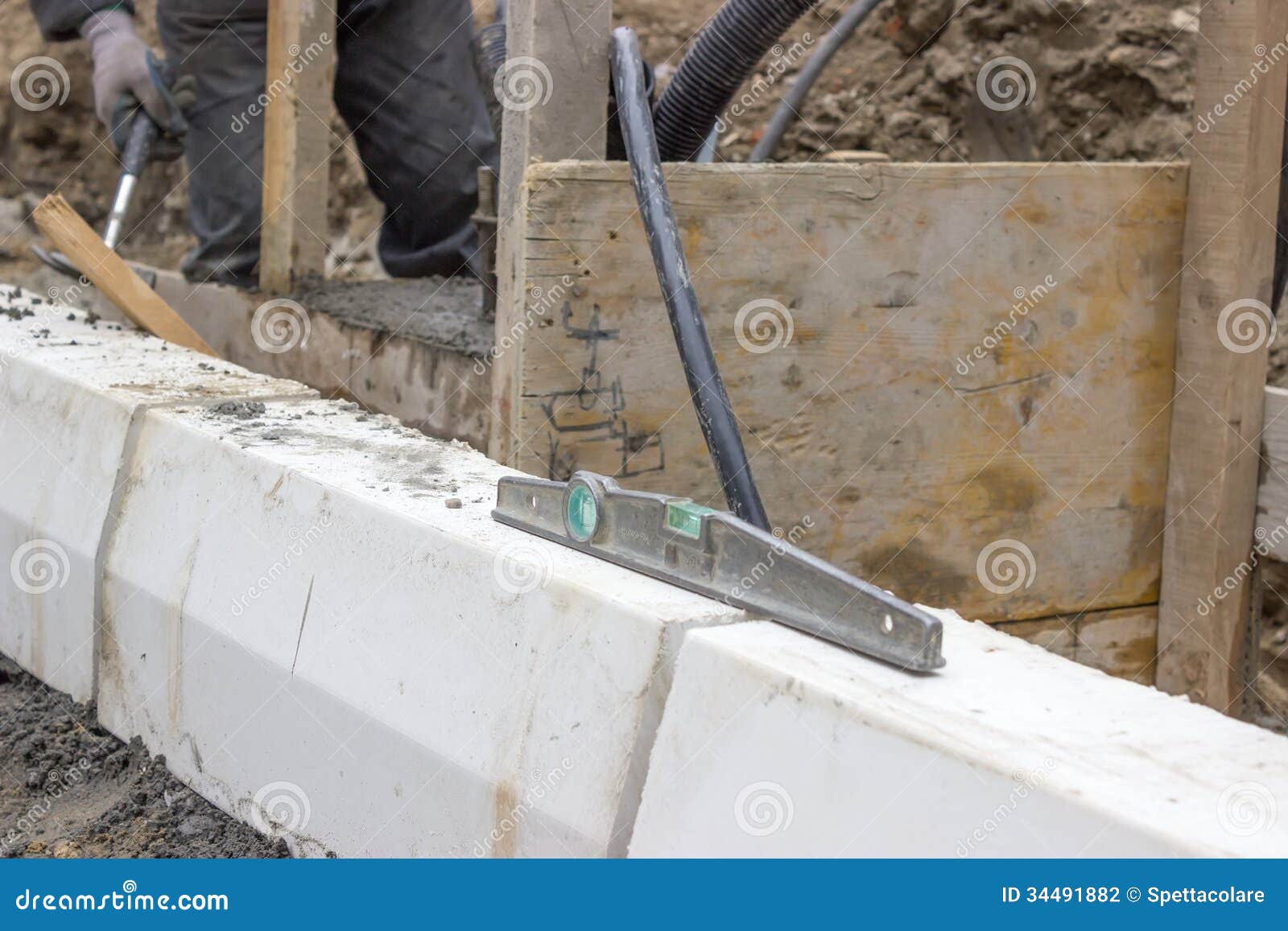 Worker Leveling Concrete Curbs 2 Stock Photo - Image of lane, footway ...