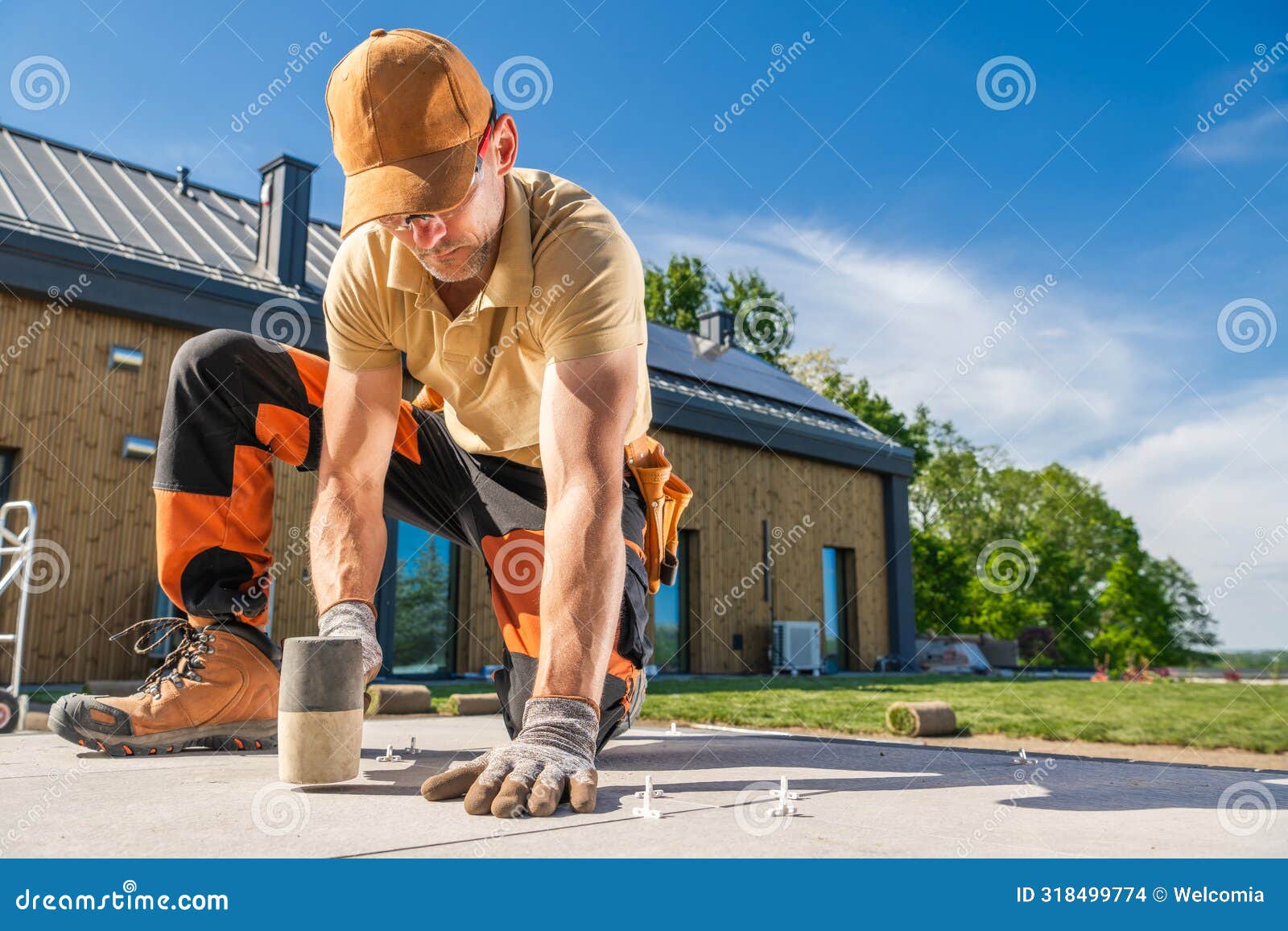 Construction Worker Leveling Concrete Patio Tiles Royalty-Free Stock ...