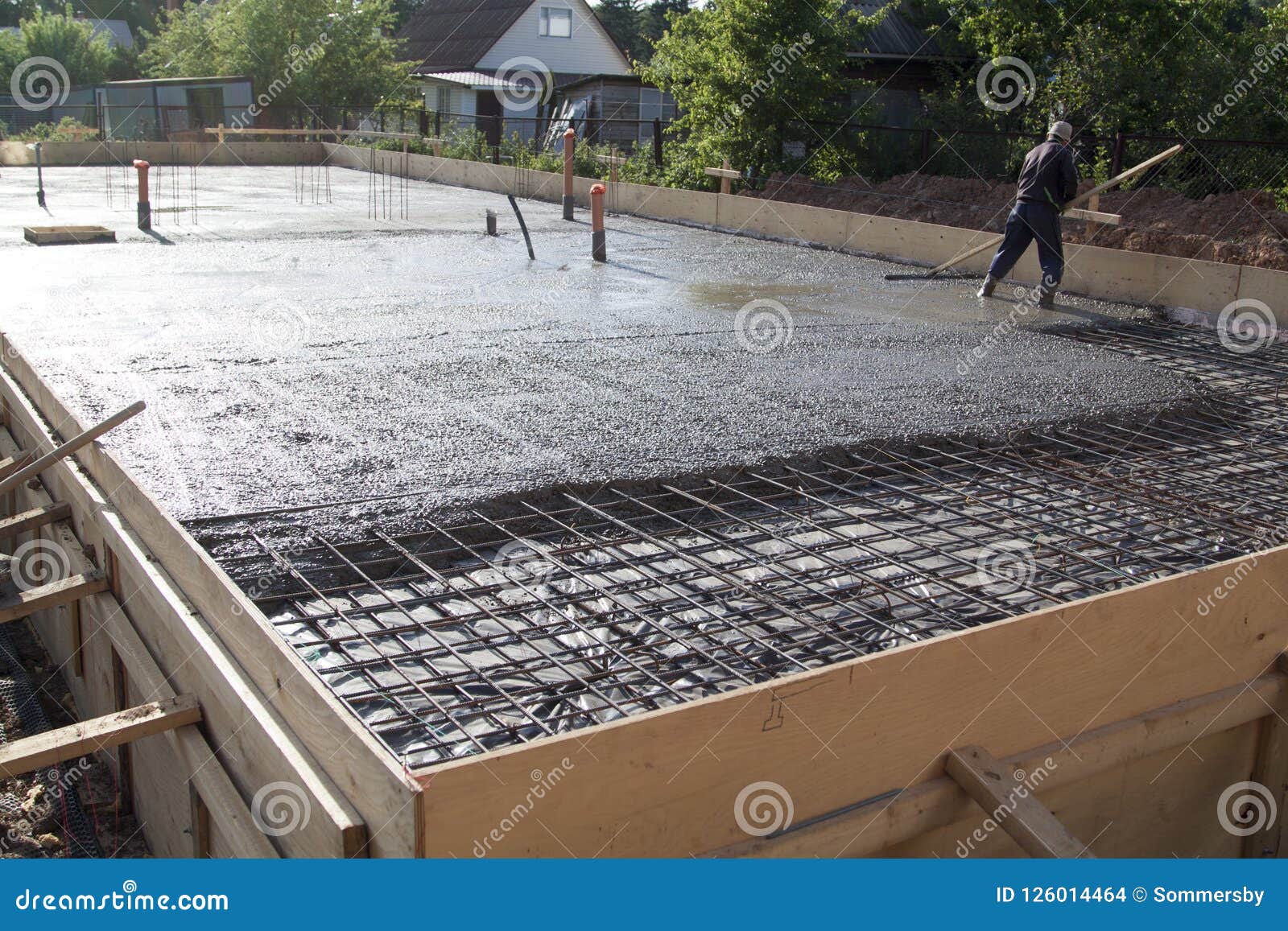 Worker Leveling Fresh Concrete Slab with a Special Working Tool Stock ...