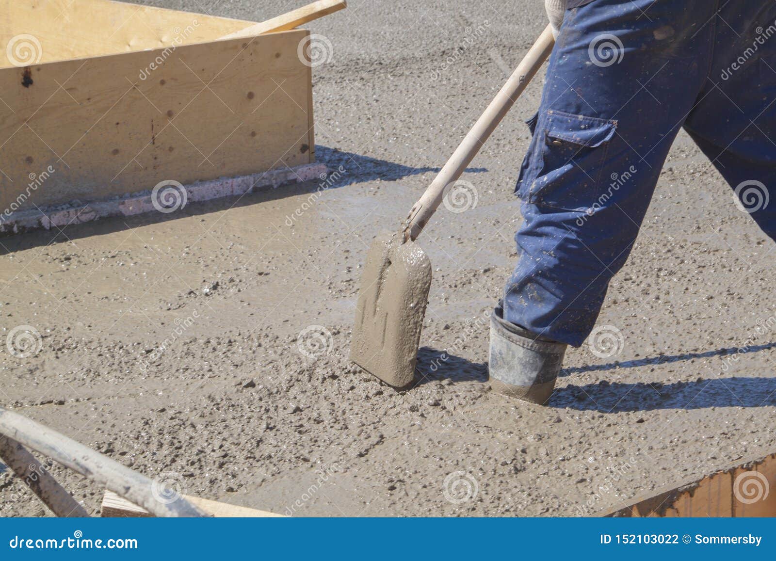 Worker Leveling Fresh Concrete Slab with a Special Working Tool Stock ...