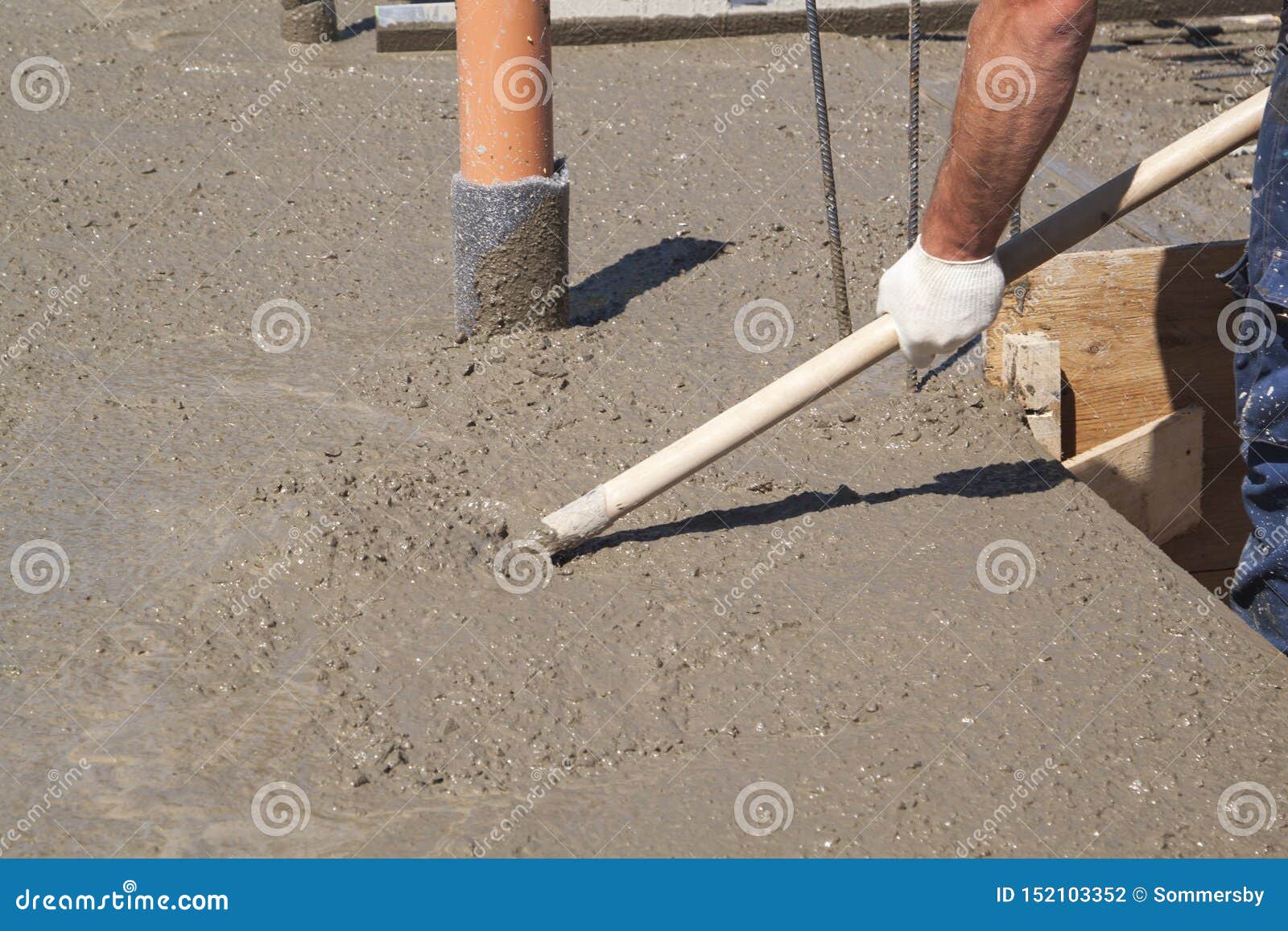 Worker Leveling Fresh Concrete Slab with a Special Working Tool Stock ...