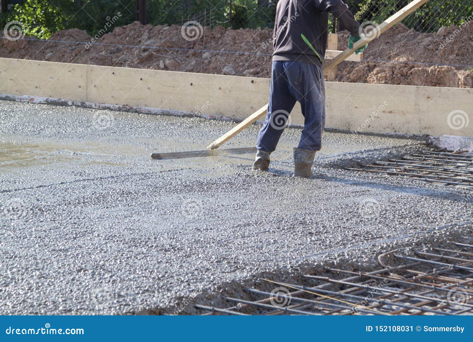 Worker Leveling Fresh Concrete Slab with a Special Working Tool Stock ...