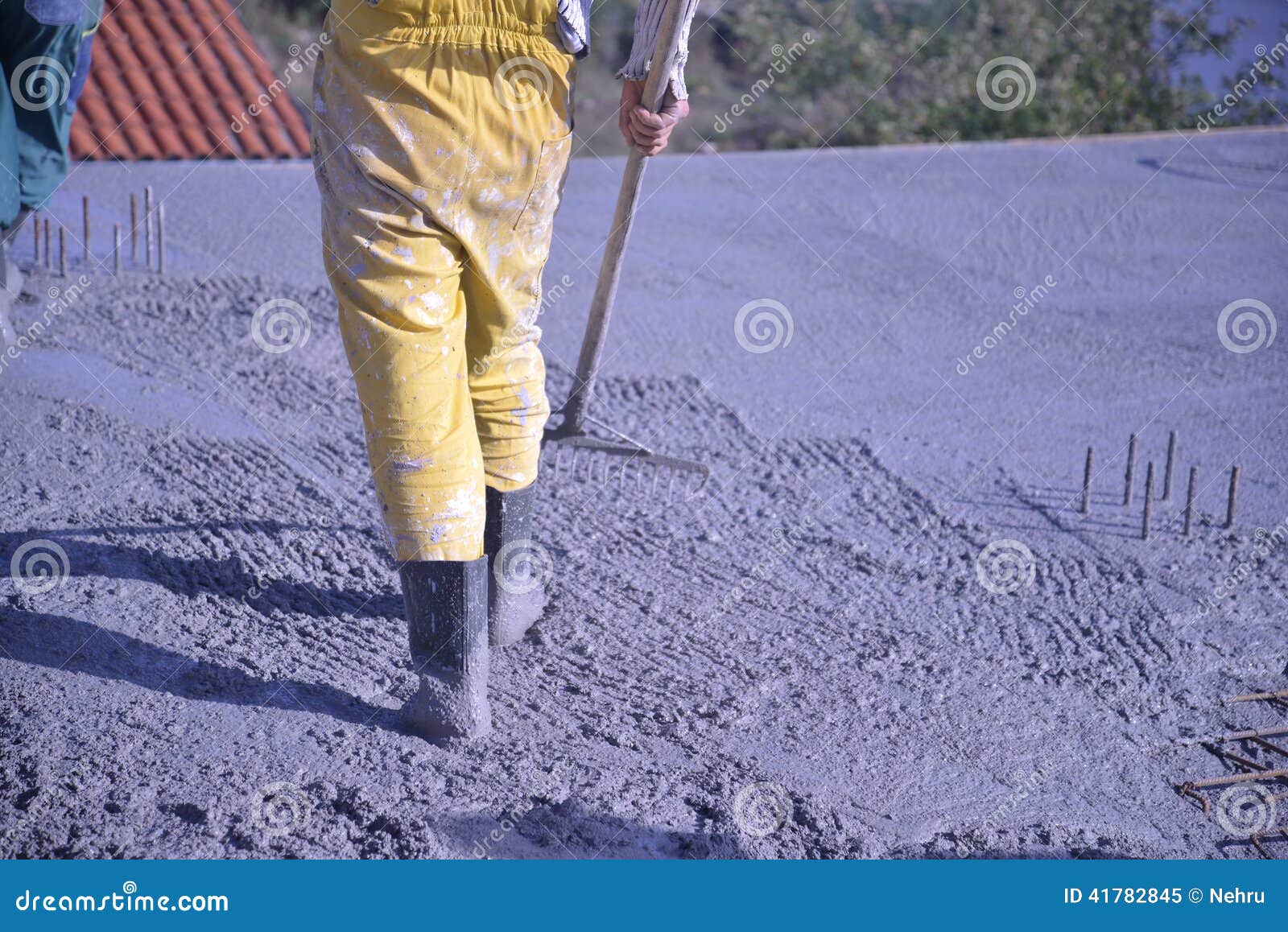 Worker Levelling Concrete stock image. Image of pouring - 41782845