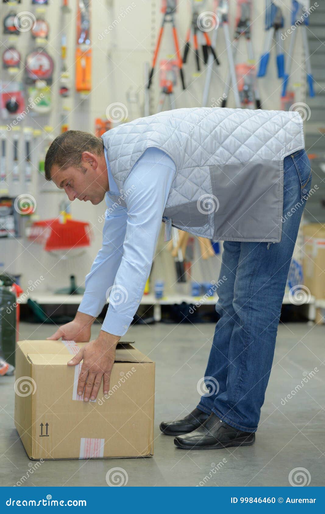 Worker while Lifting Box in Warehouse Stock Photo - Image of packaging ...