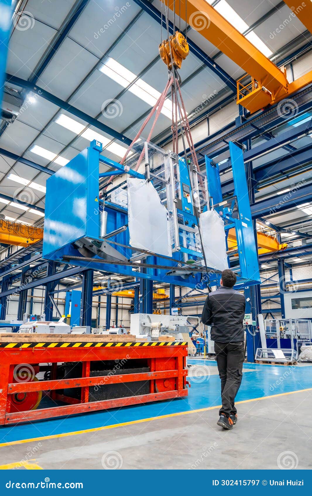 Worker Lifting Heavy Machinery Using a Crane Stock Image - Image of ...