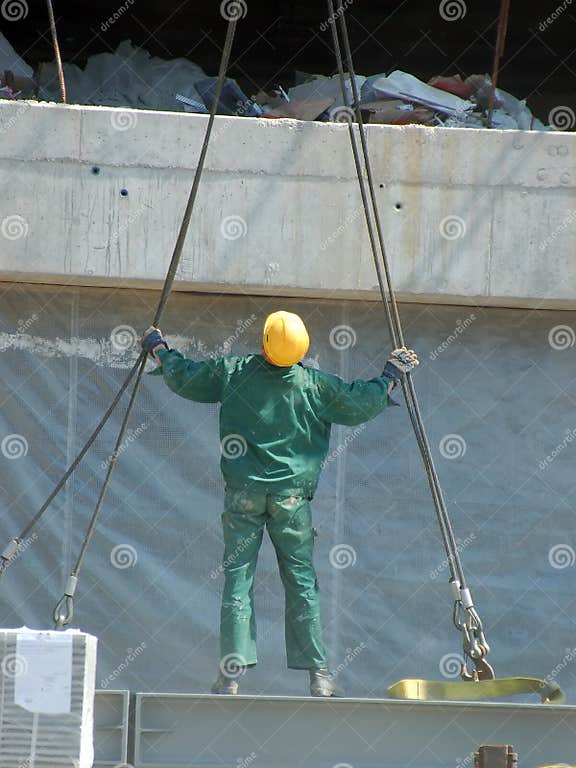 Worker with lifting ropes stock image. Image of fitting - 769897