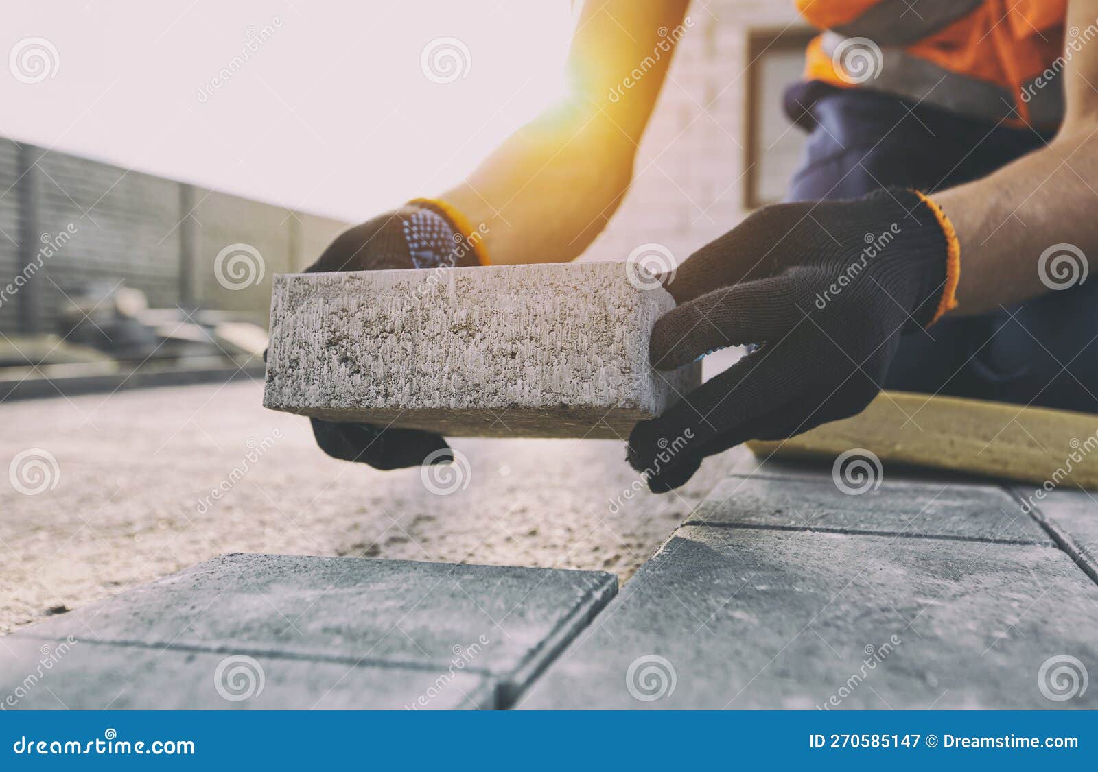 Worker lining paving slabs stock image. Image of builder - 270585147