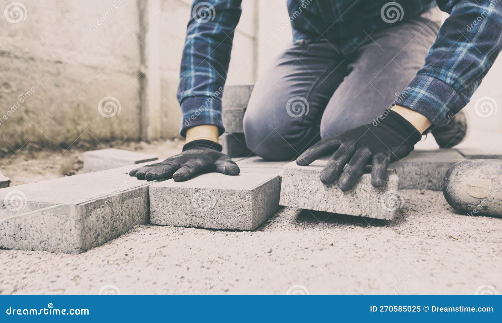 Worker lining paving slabs stock image. Image of gardening - 270585025
