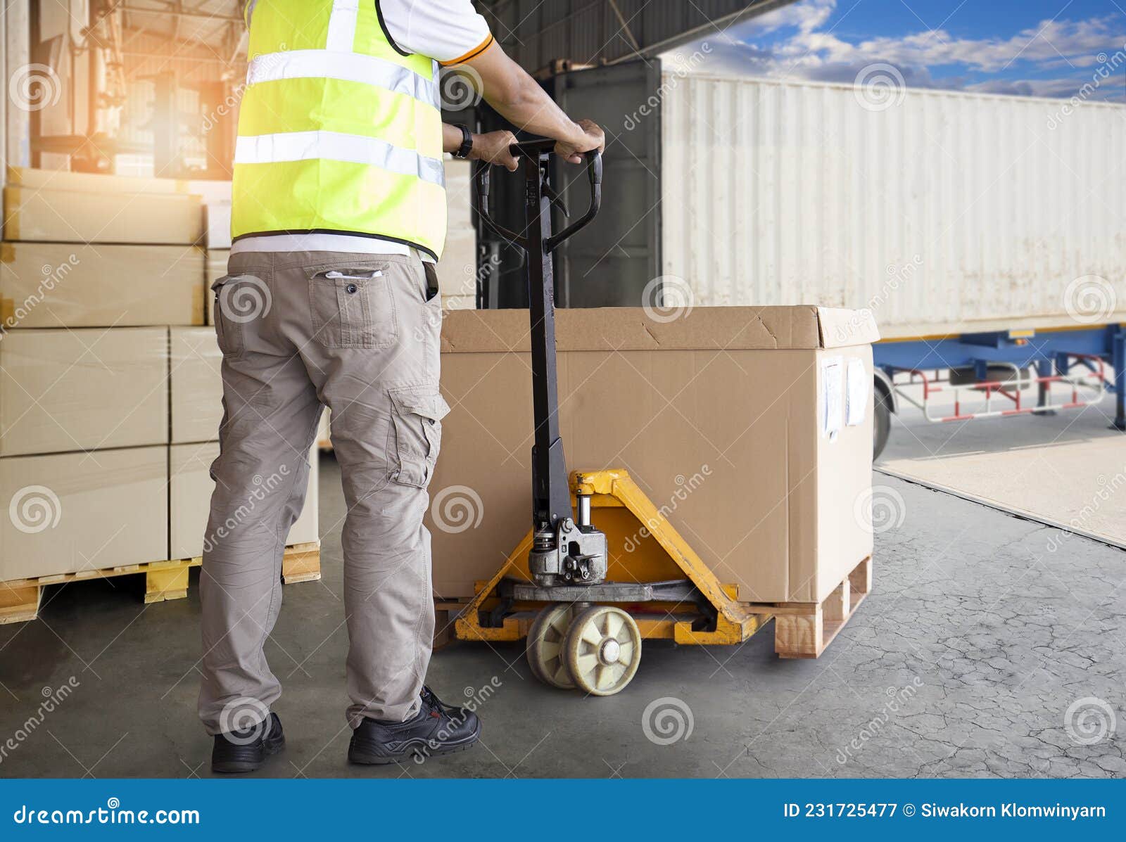 Worker Loading Package Boxes into Cargo Container at Dock Warehouse ...
