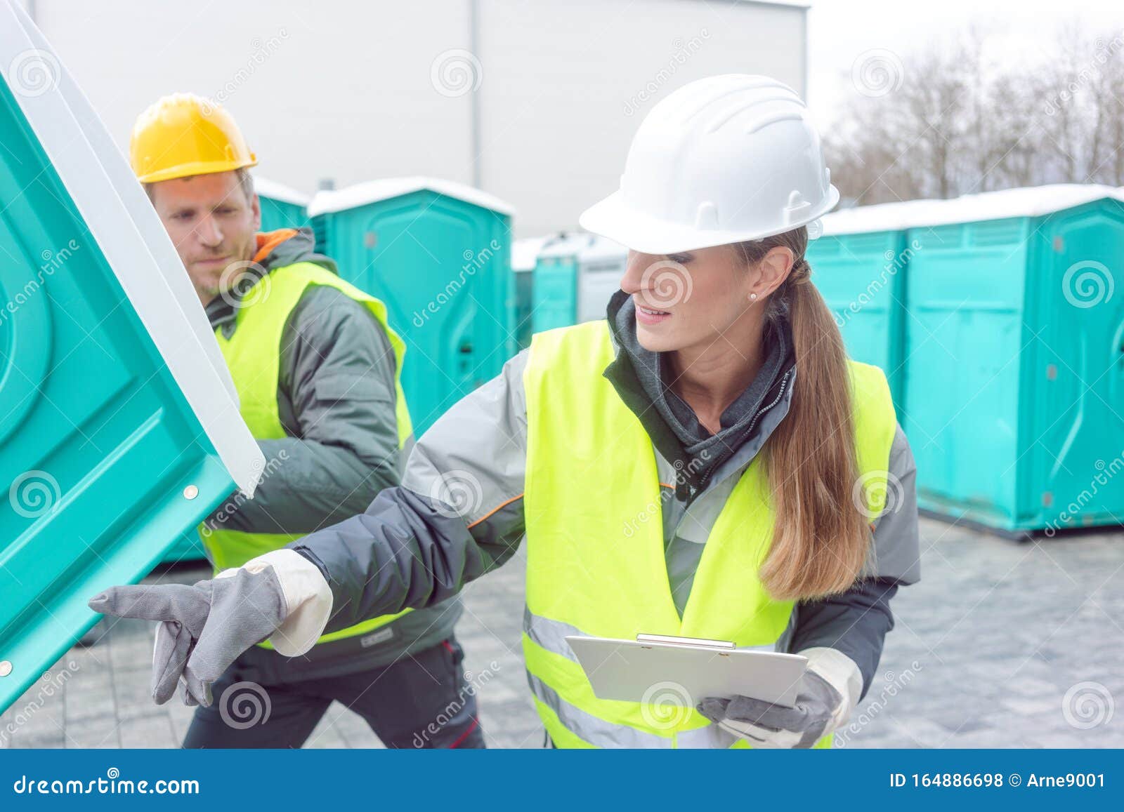 Worker Loading Portable Toilets on Truck Stock Photo - Image of toilet ...