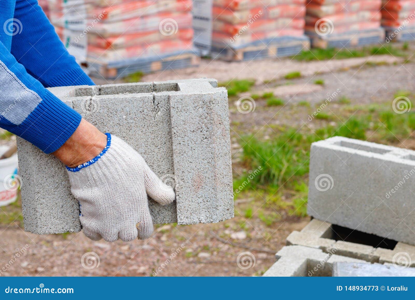Worker Loads Cinder Blocks from Cement Slurry for Construction Stock ...