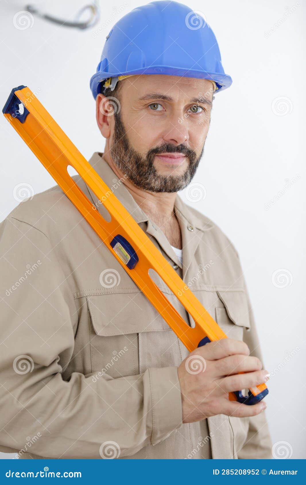 Worker Looking at Builders Level Stock Photo - Image of process, male ...
