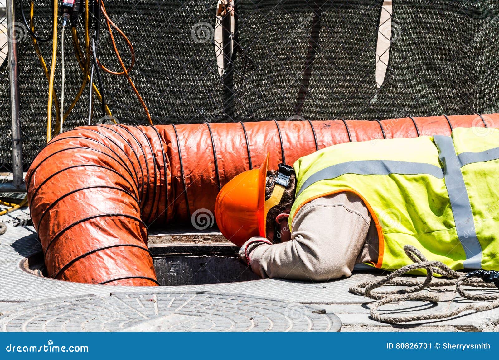 Worker Looking Down Manhole Photos - Free & Royalty-Free Stock Photos ...