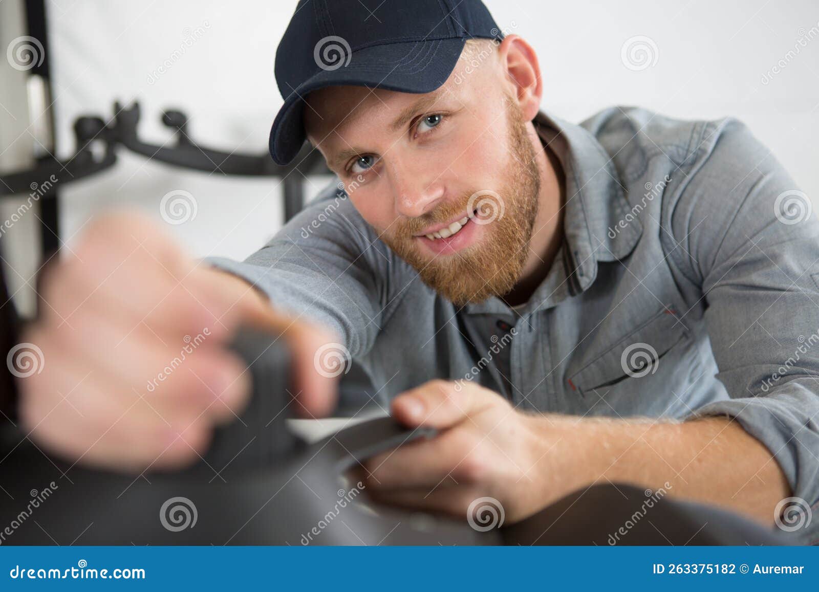 Worker Looks Directly into Camera and Smiles Stock Photo - Image of ...