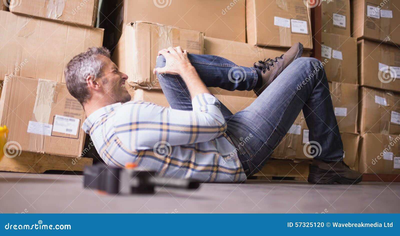 Worker Lying on the Floor in Warehouse Stock Photo - Image of lying ...