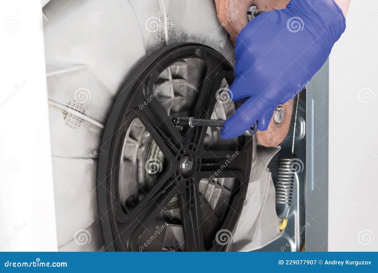 A Worker Makes Diagnostics and Maintenance of Household Appliances ...