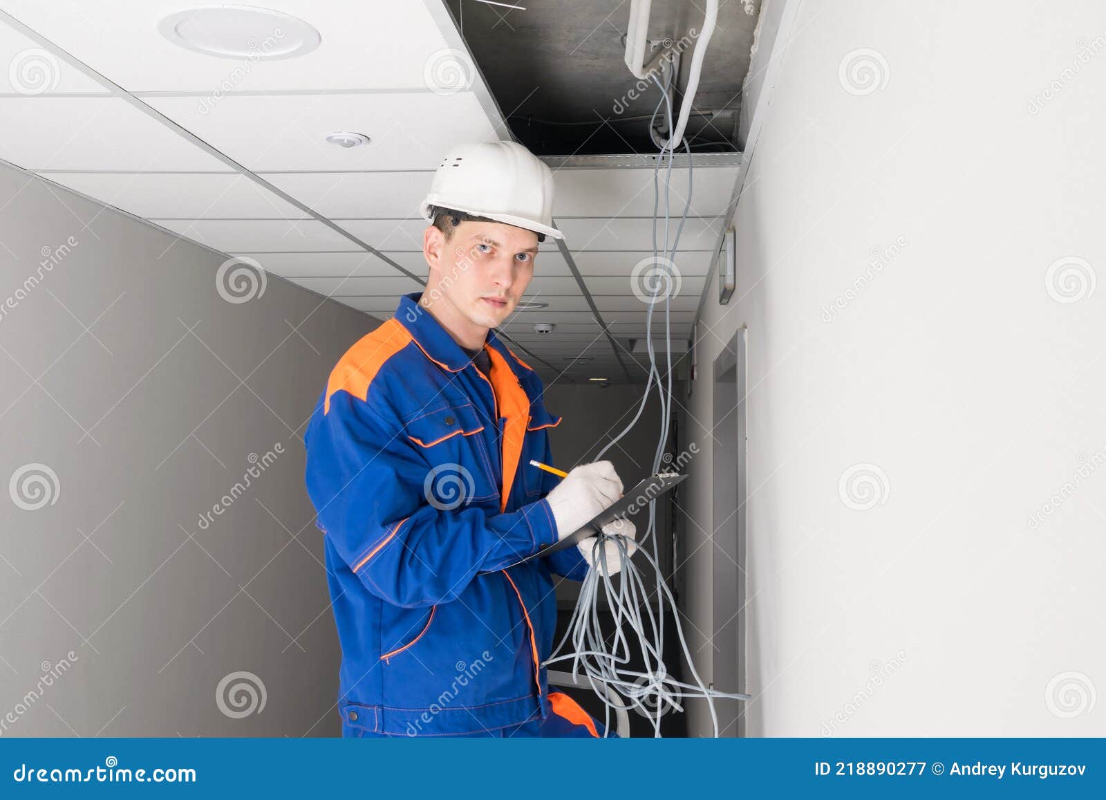 A Worker Makes a Note about the Completion of Technical Work on Setting ...