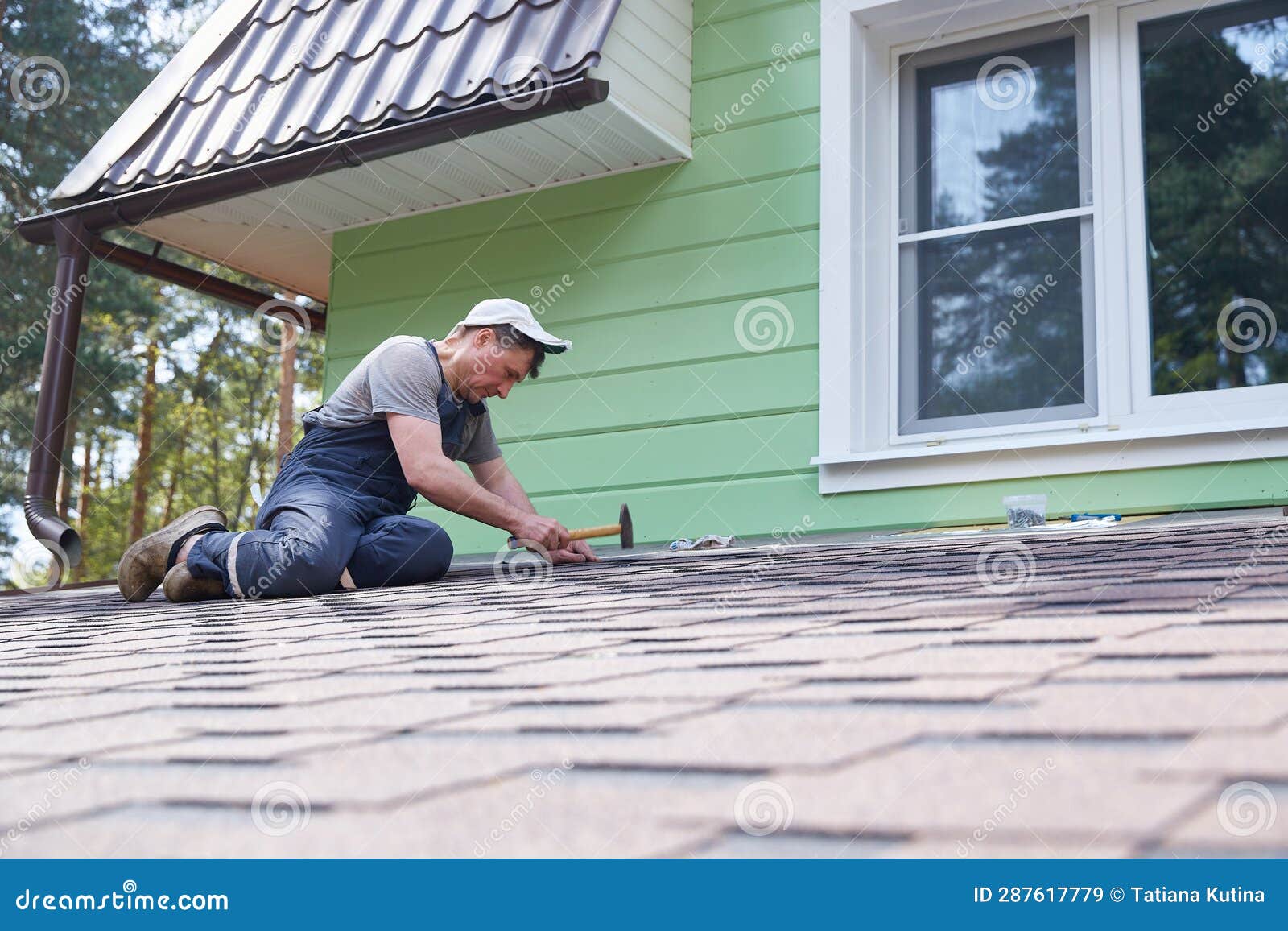 A Worker Makes a Roof Out of Soft Tiles. Stock Image - Image of ...