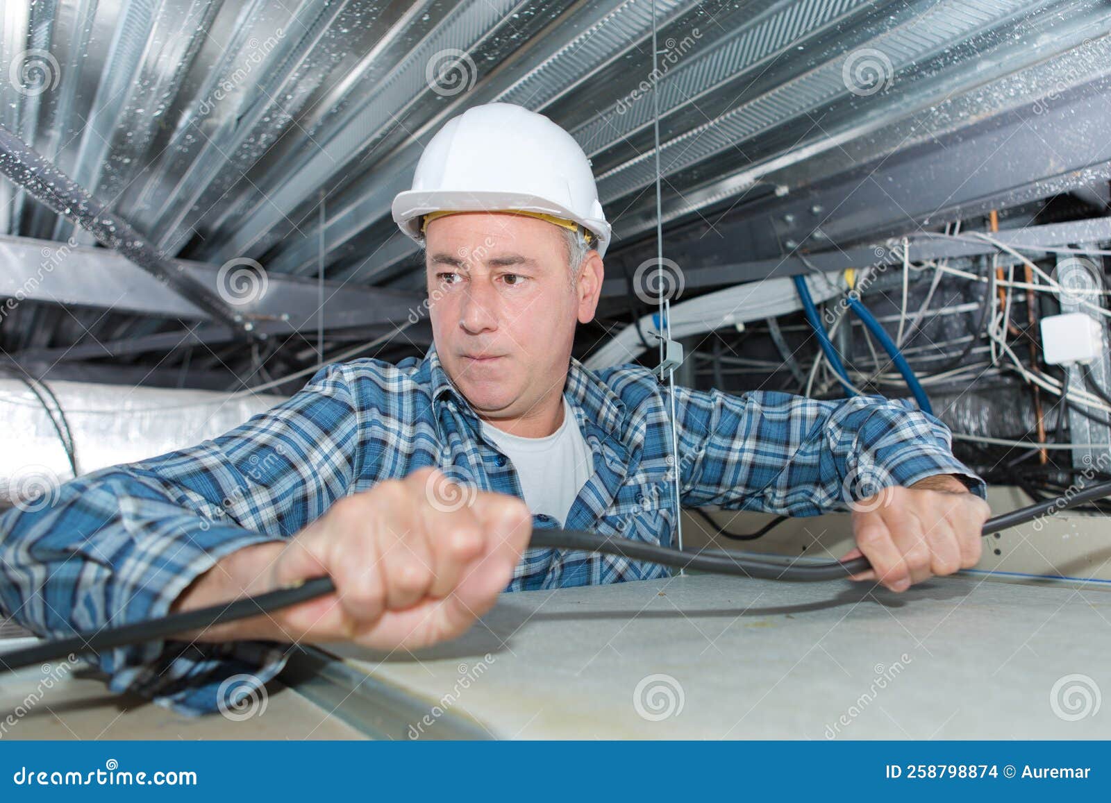 Worker Making Mounting for Electric Cable in Ceiling Stock Photo ...