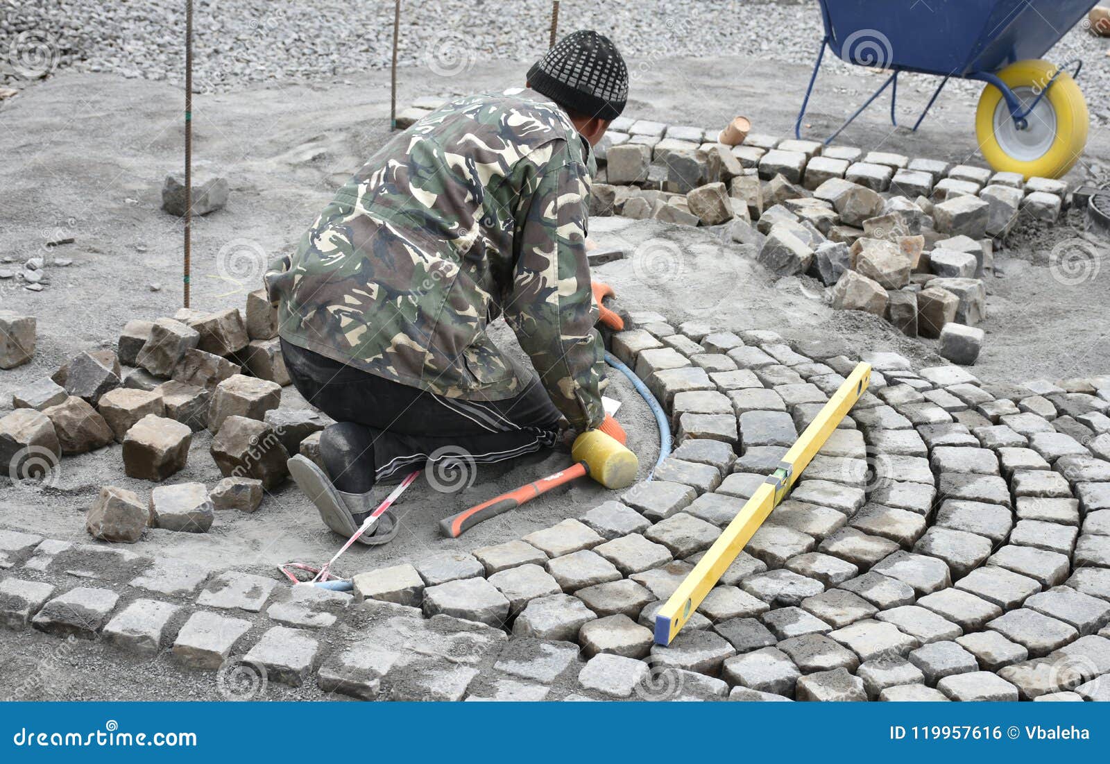 Worker Making the Pavement of Stone Blocks Editorial Photo - Image of ...