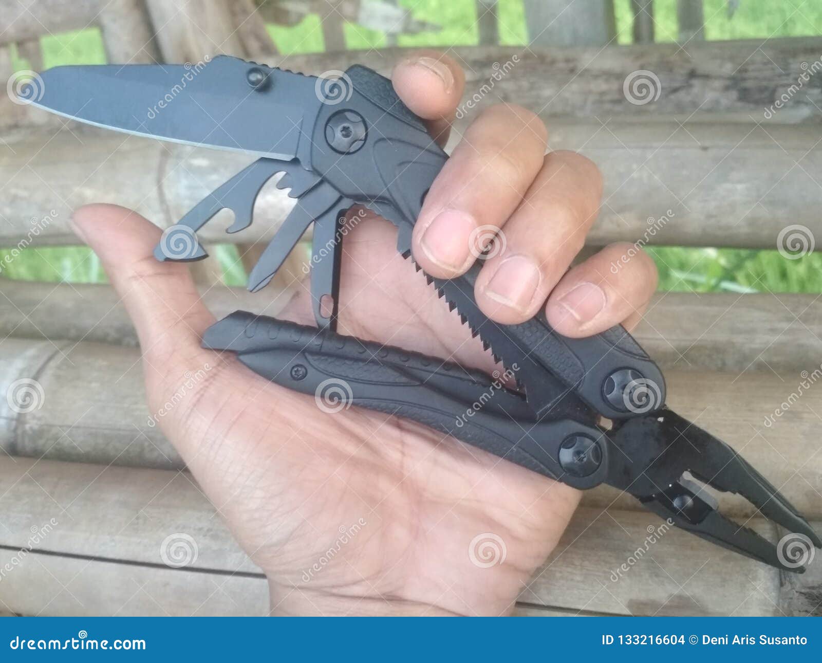 Male hand holding tool stock photo. Image of equipment - 133216604