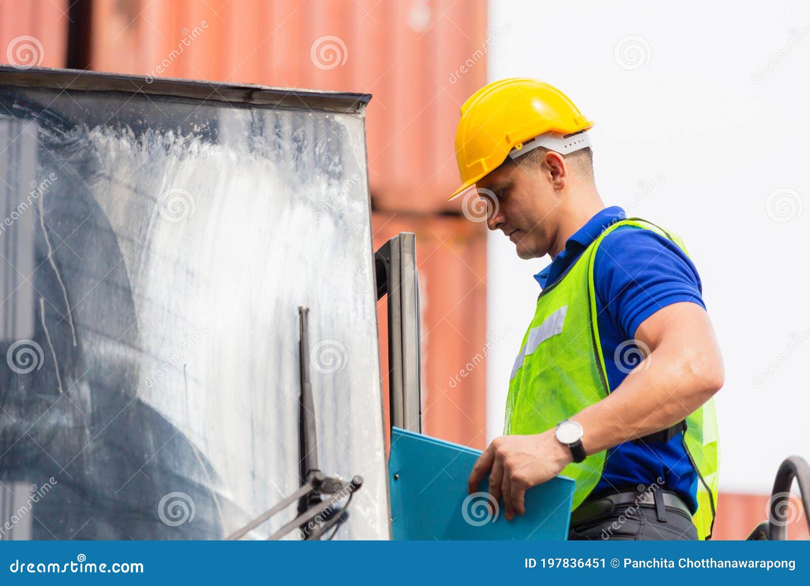 Worker Man in Hard Hat and Safety Vest Standing on Container Stackers ...