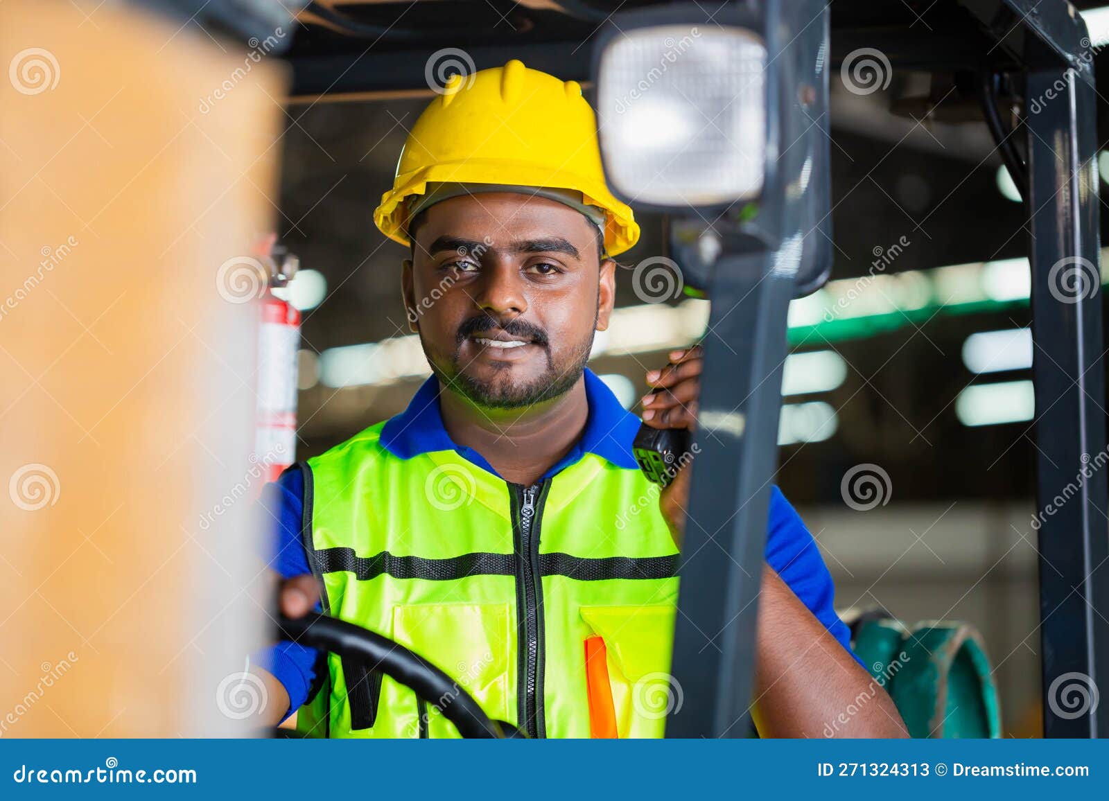Worker Man in Hardhat and Safety Vest Driving Forklift for Control ...