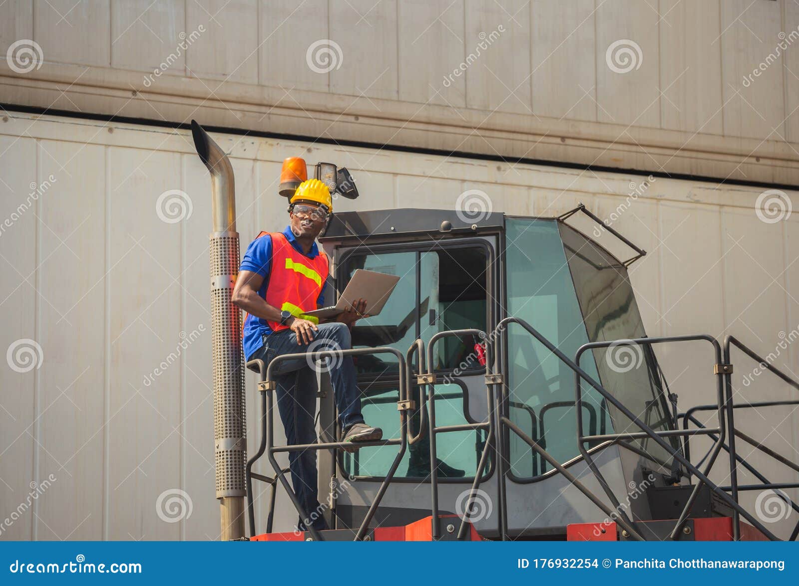 Worker Man in Hardhat and Safety Vest Holding Laptop Standing on ...