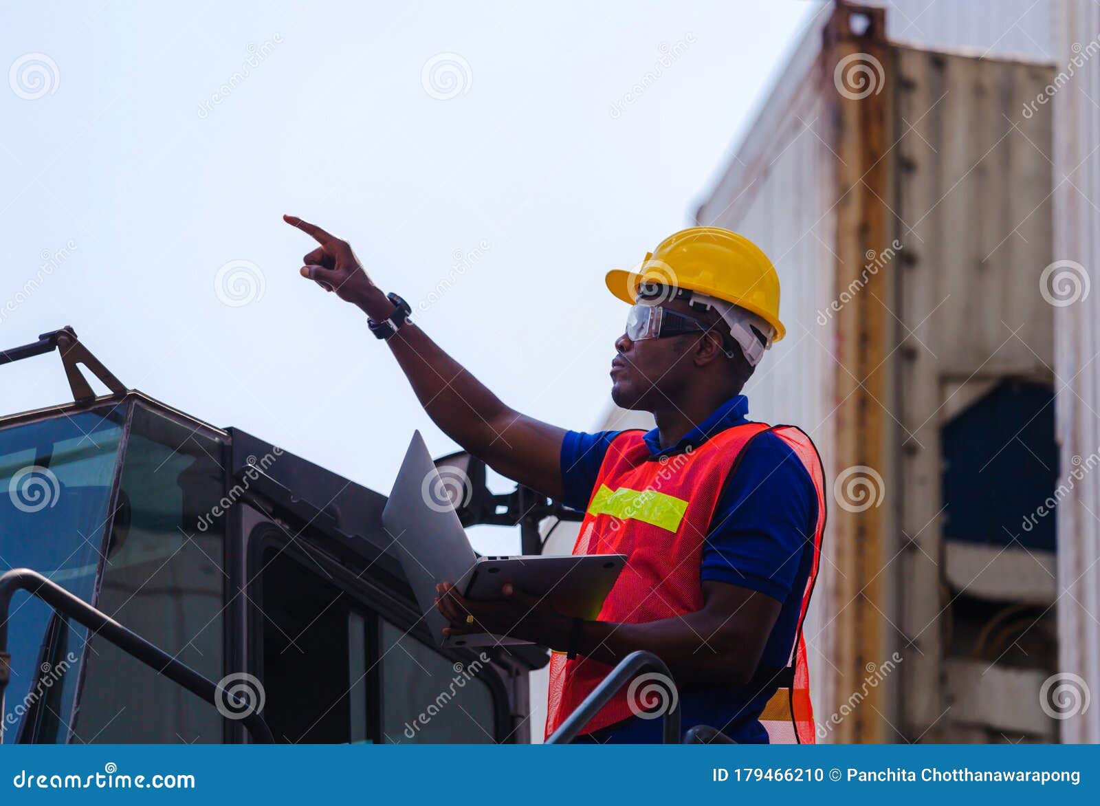 Worker Man in Hardhat and Safety Vest Holding Laptop Standing on ...