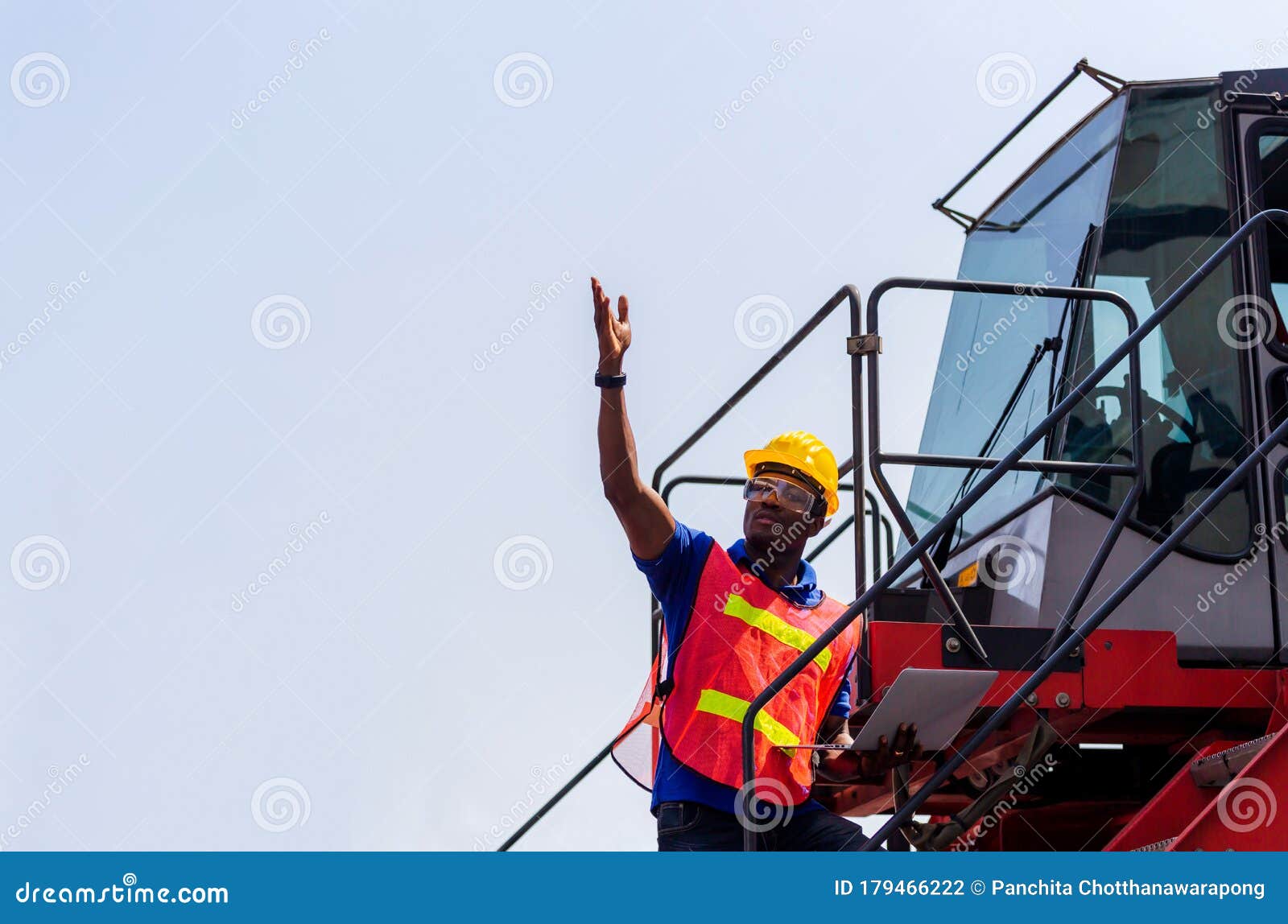 Worker Man in Hardhat and Safety Vest Holding Laptop Standing on ...