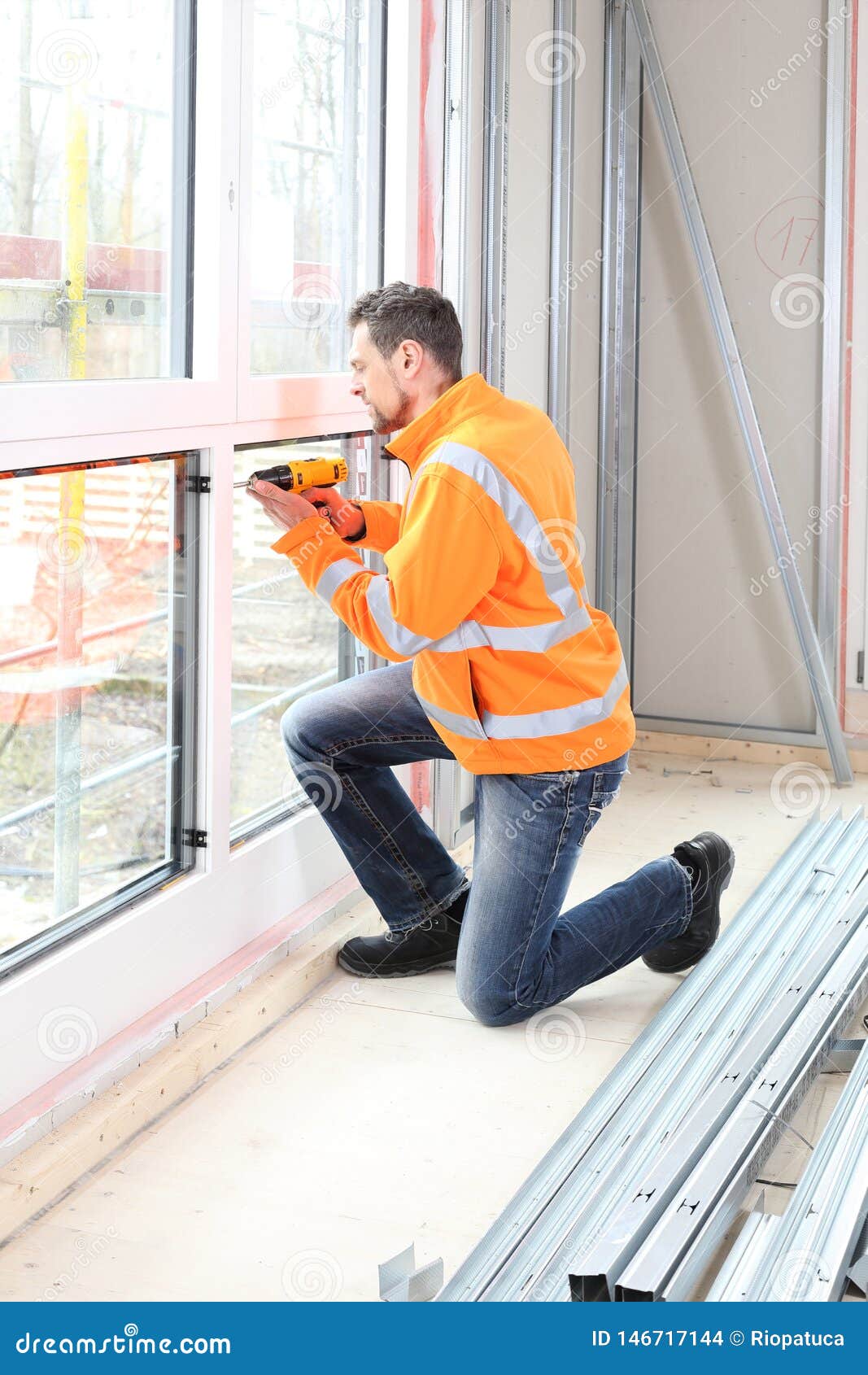 Worker Man Installing a Wooden Window on Construction Site Stock Photo ...