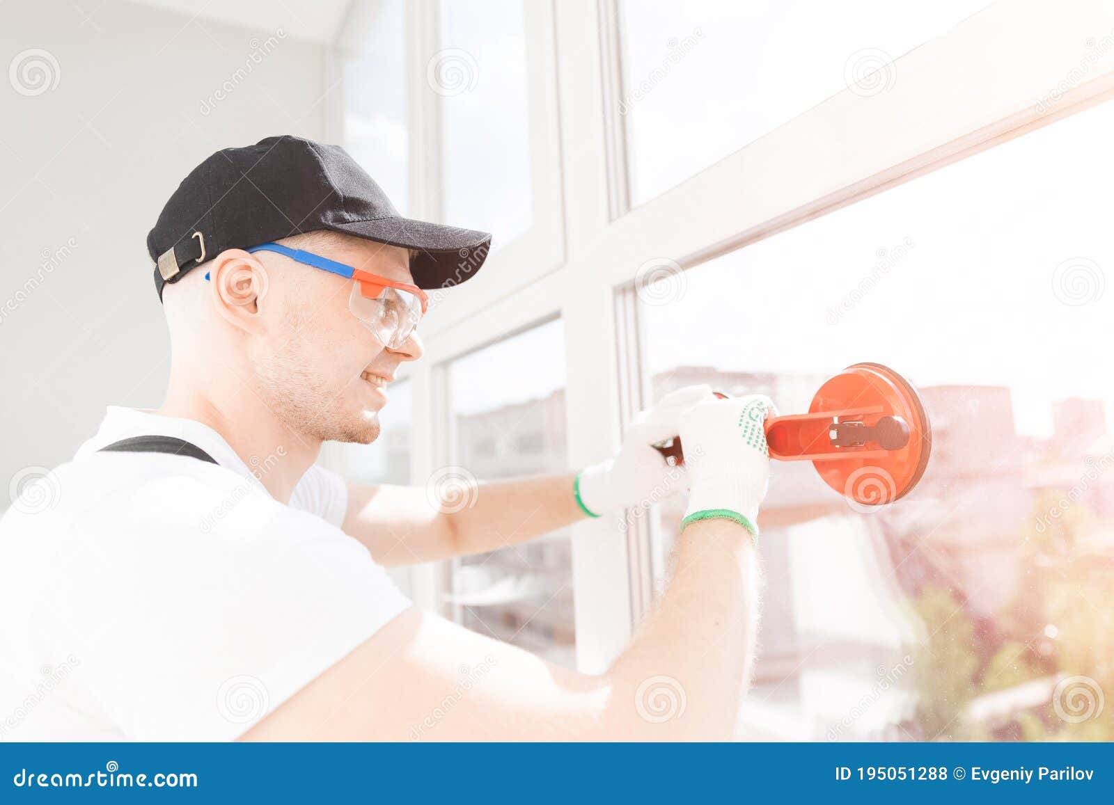 Worker Man Installs Upvc Plastic Windows Using Suction Cup Stock Photo ...