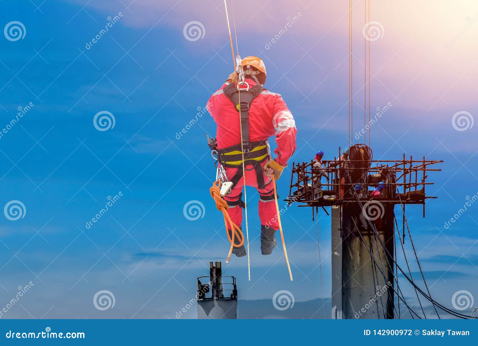 Worker Man Sprinkle of High and Worker on Scaffolding with Harness ...