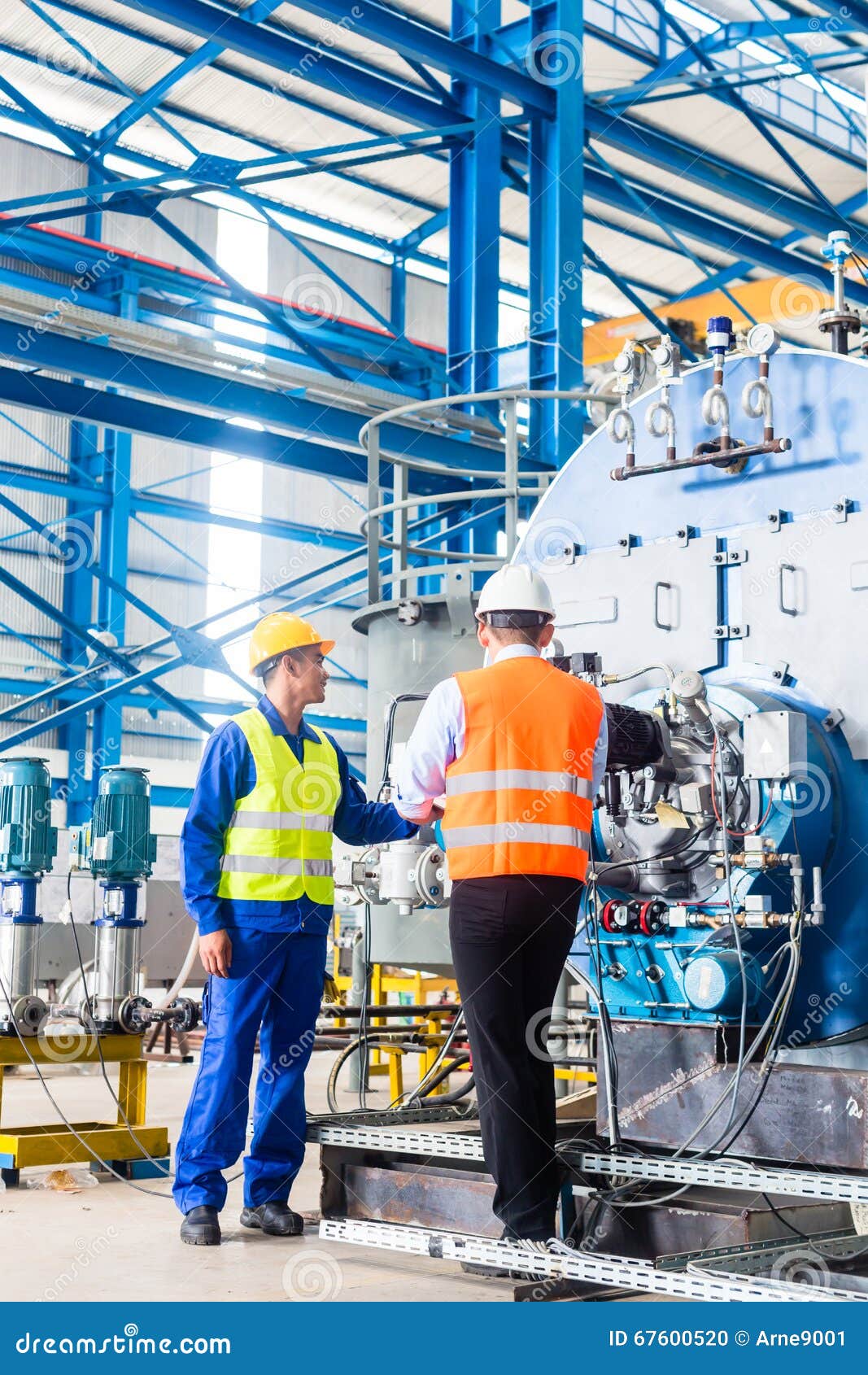 Worker and Manager in Industrial Factory Stock Photo - Image of ...