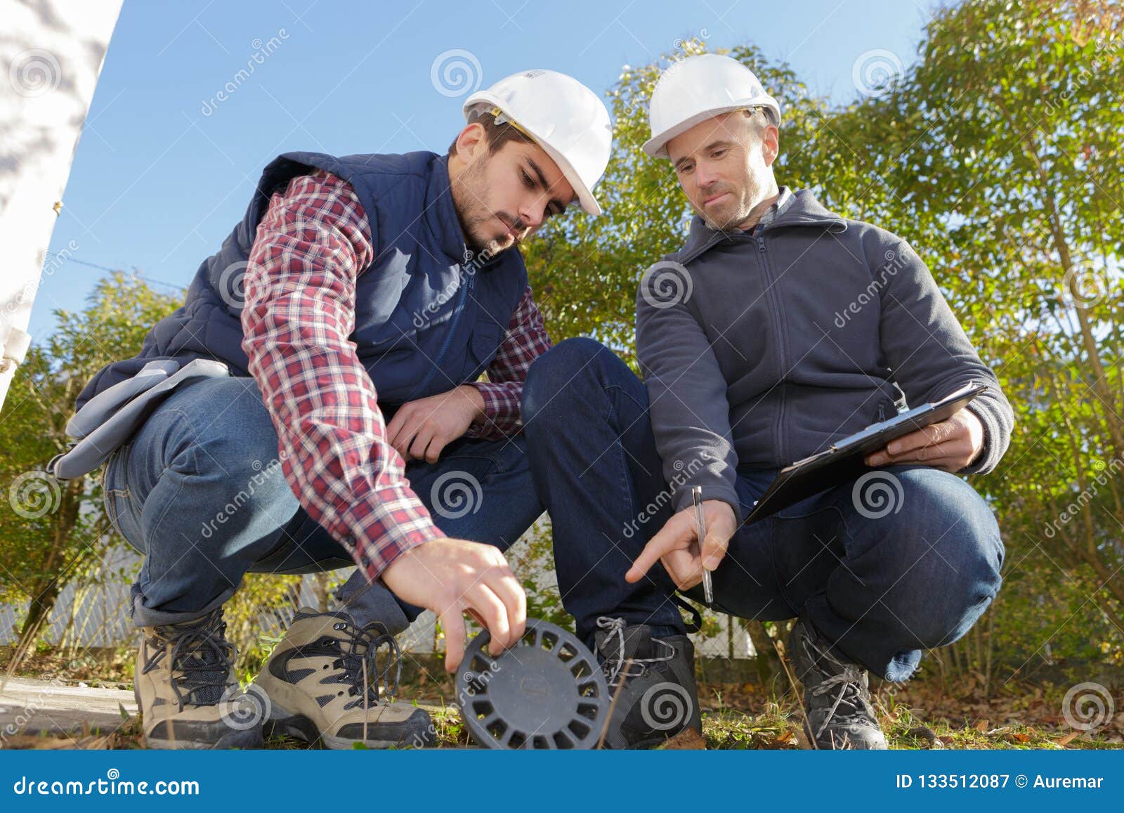 Worker and Manager Inspecting Sewer Drain Stock Image - Image of pipe ...