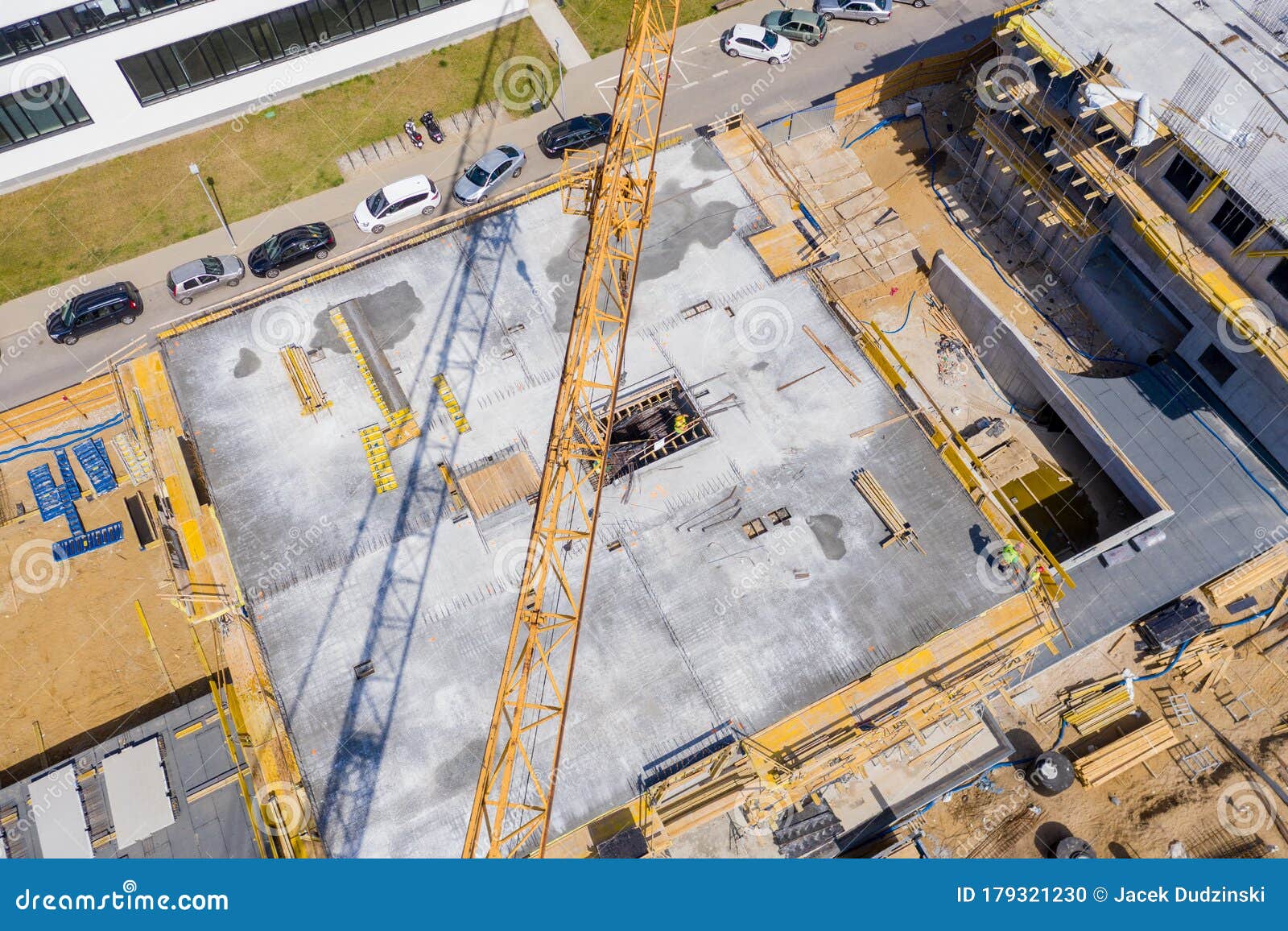 Worker is Managing an Elevated Cherry Picker at Building Site. Aeria ...