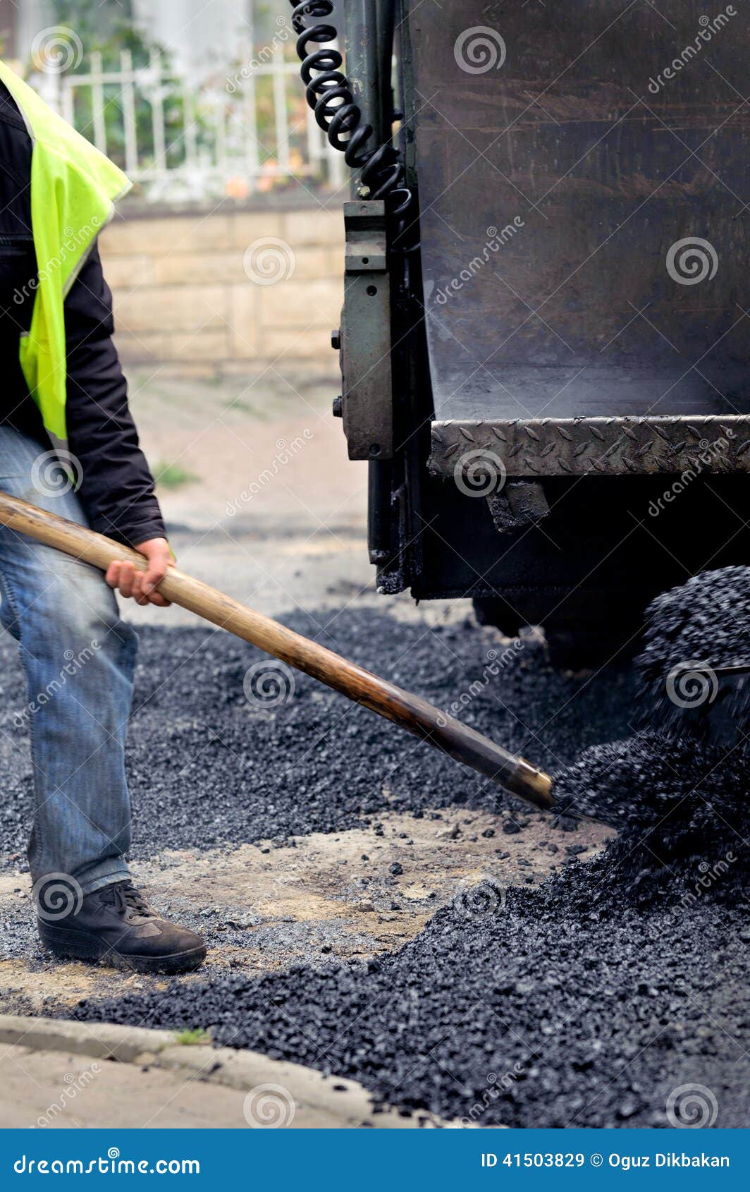Worker Manually Effusing Asphalt with Paving Machine Stock Image ...
