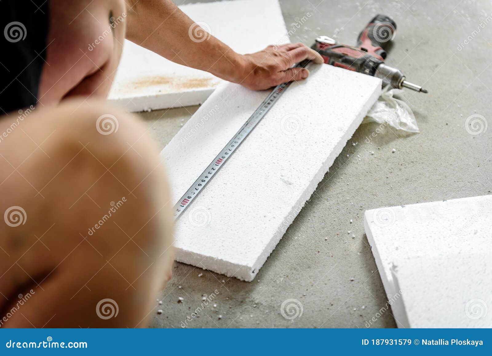 Worker Mark the Correct Length and Dimension of Styrofoam on ...