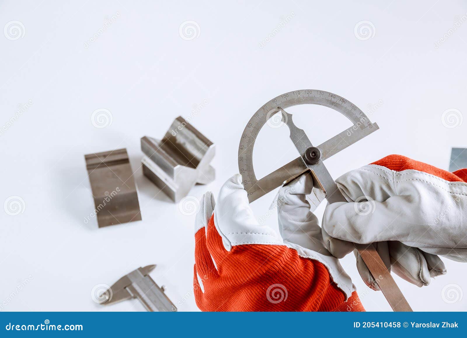 The Worker Measures the Angle on the Metal Product with a Protractor ...