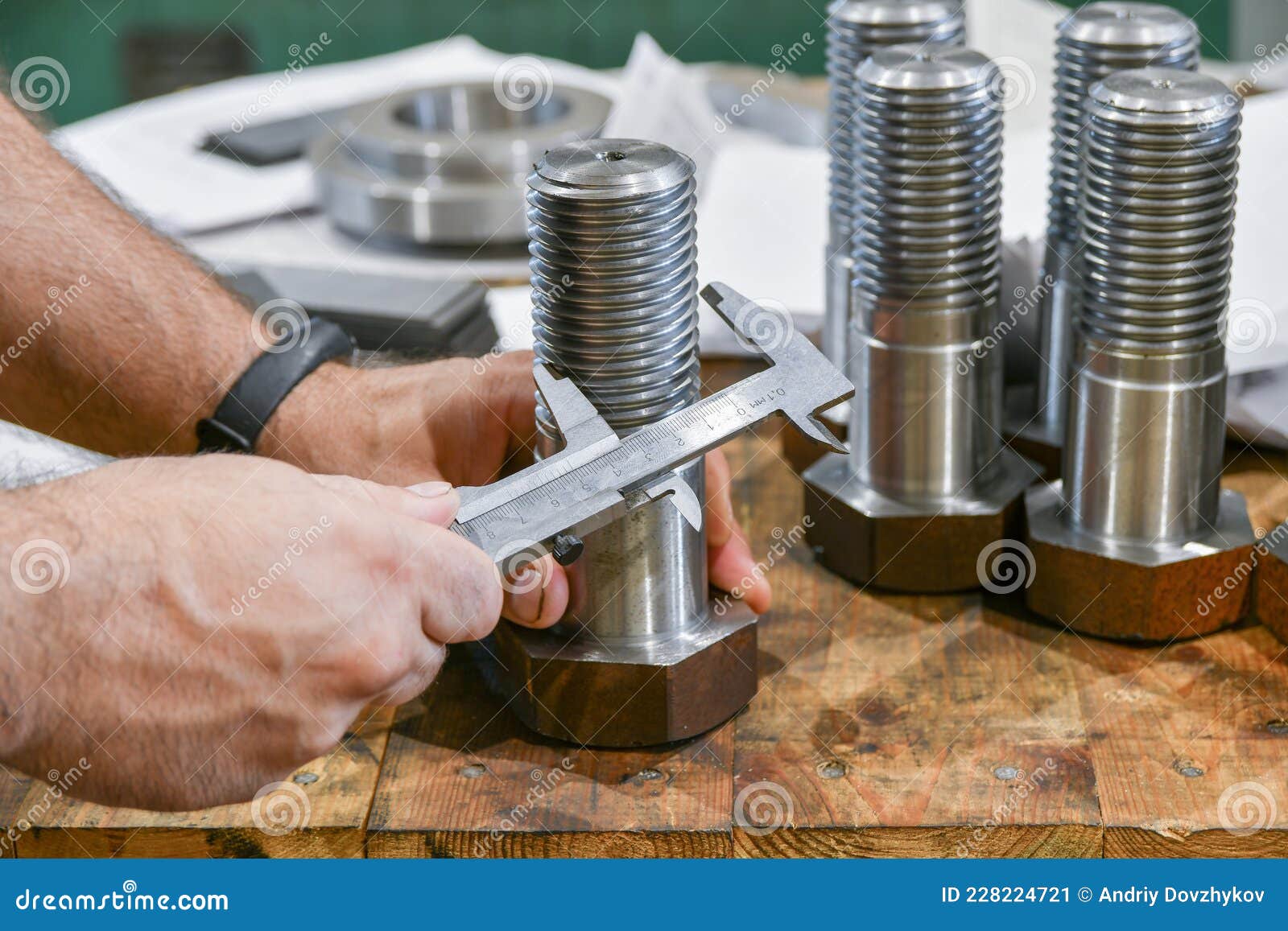 The Worker Measures the Diameter of the Thread on the Bolt with a ...