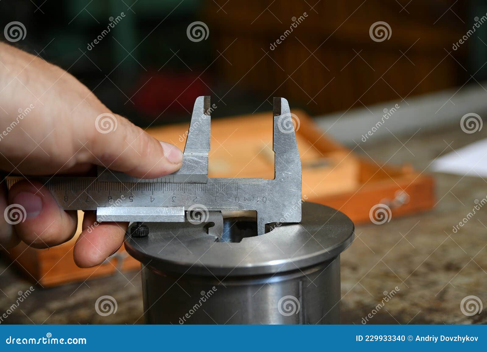 The Worker Measures the Inner Diameter of the Hole with a Bore Gauge ...