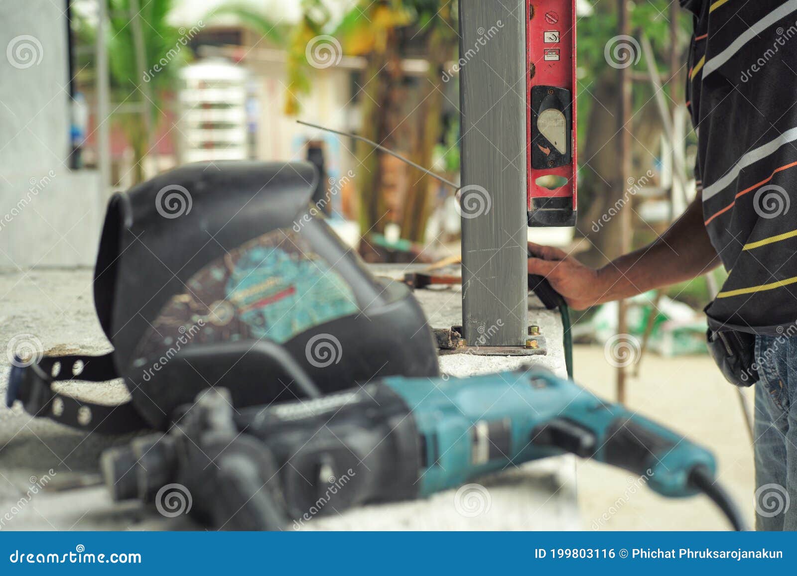 Worker Measures the Level of Perpendicular during Installing the Steel ...