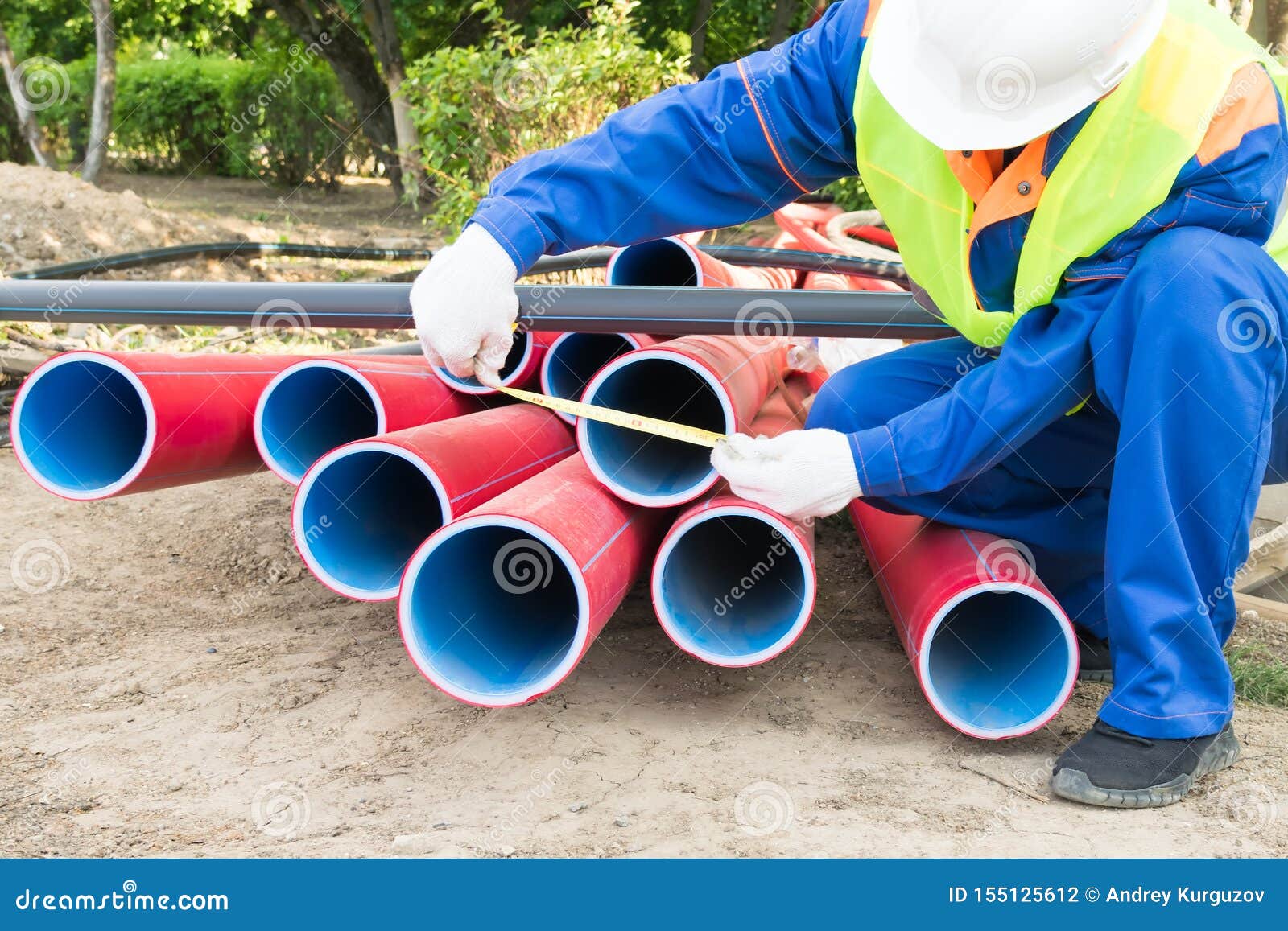 Worker Measures Red Plastic Pipes Front View Stock Photo - Image of ...